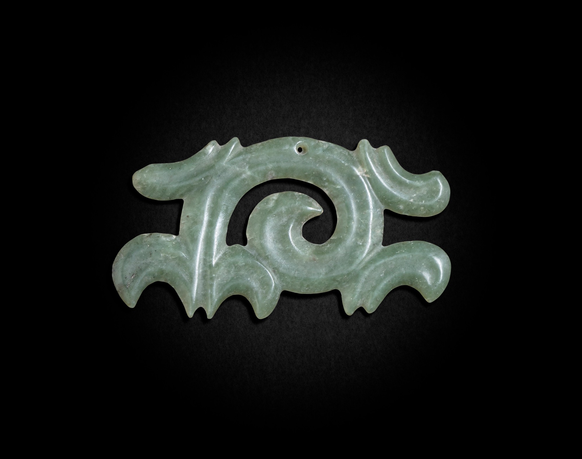 A pale green jade 'cloud-shaped' pendant Neolithic period, Hongshan ...
