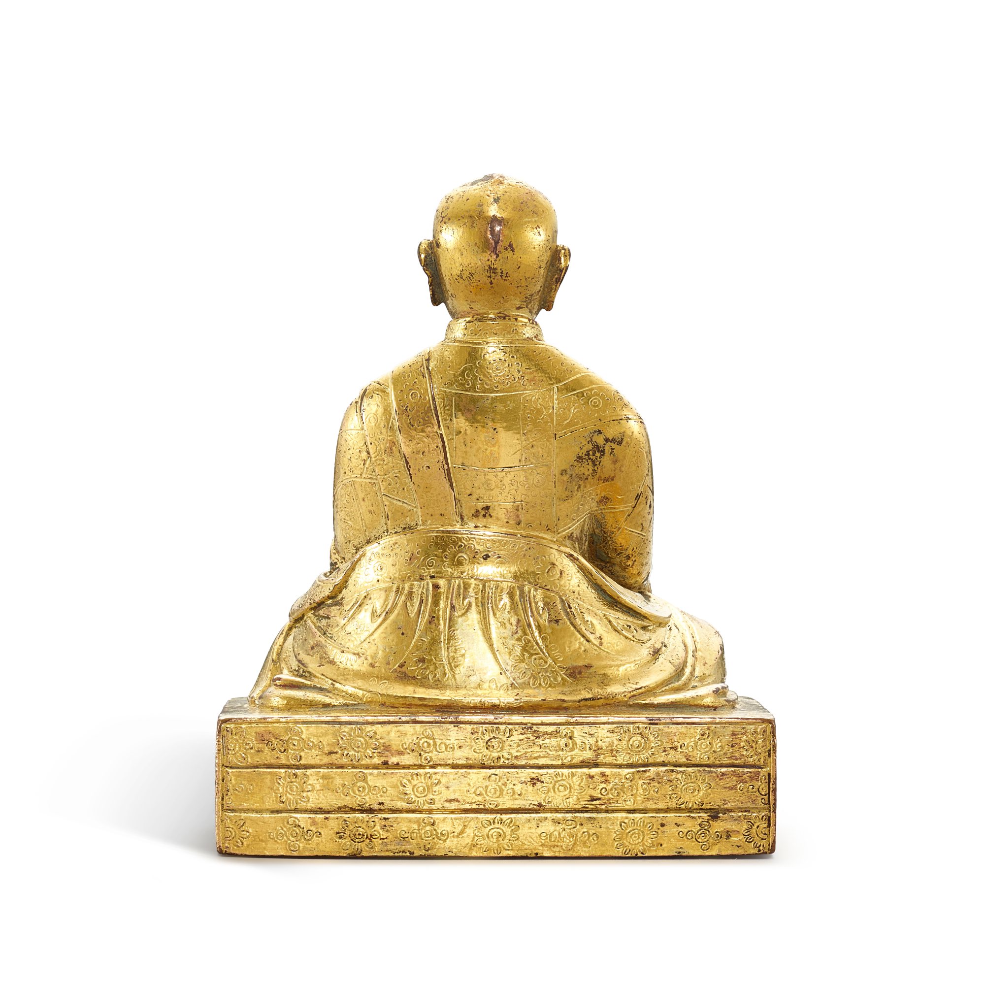 A gilt-bronze figure of a lama, Tibet, 18th century 十八世紀 藏傳鎏金銅喇嘛坐像 ...
