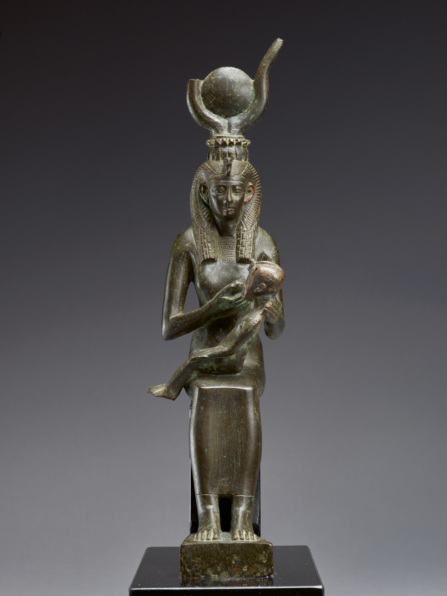 An Egyptian Bronze Figure of Isis with Horus, 26th Dynasty, 664-525 B.C ...