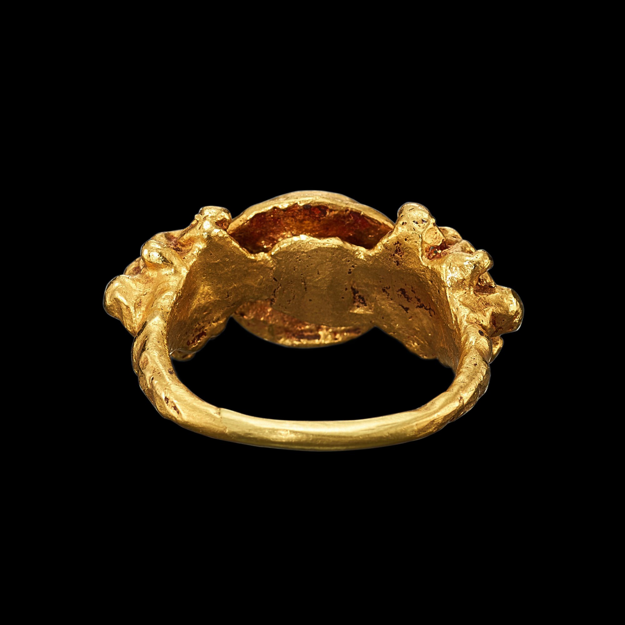 A solid gold ring with an incised bezel of a 'Sri' symbol Java ...