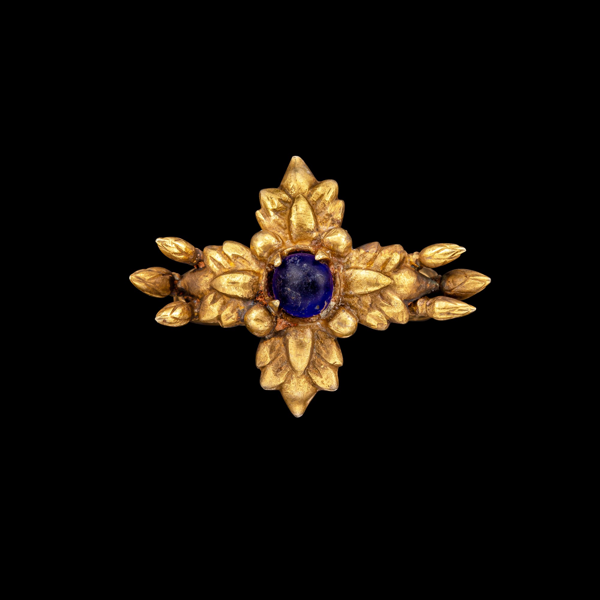 A gold and blue-gem 'four-pointed lotus' ring Possibly Champa, 14th ...