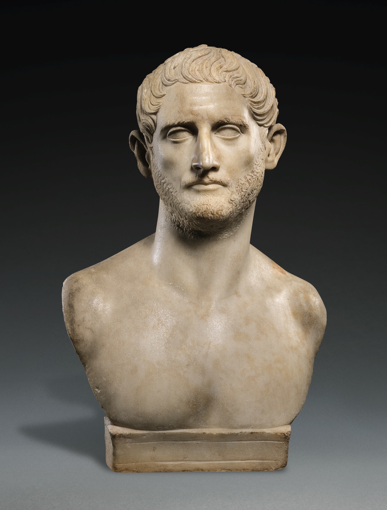 A ROMAN MARBLE PORTRAIT BUST OF A MAN TRAJANIC EARLY 2ND CENTURY A D