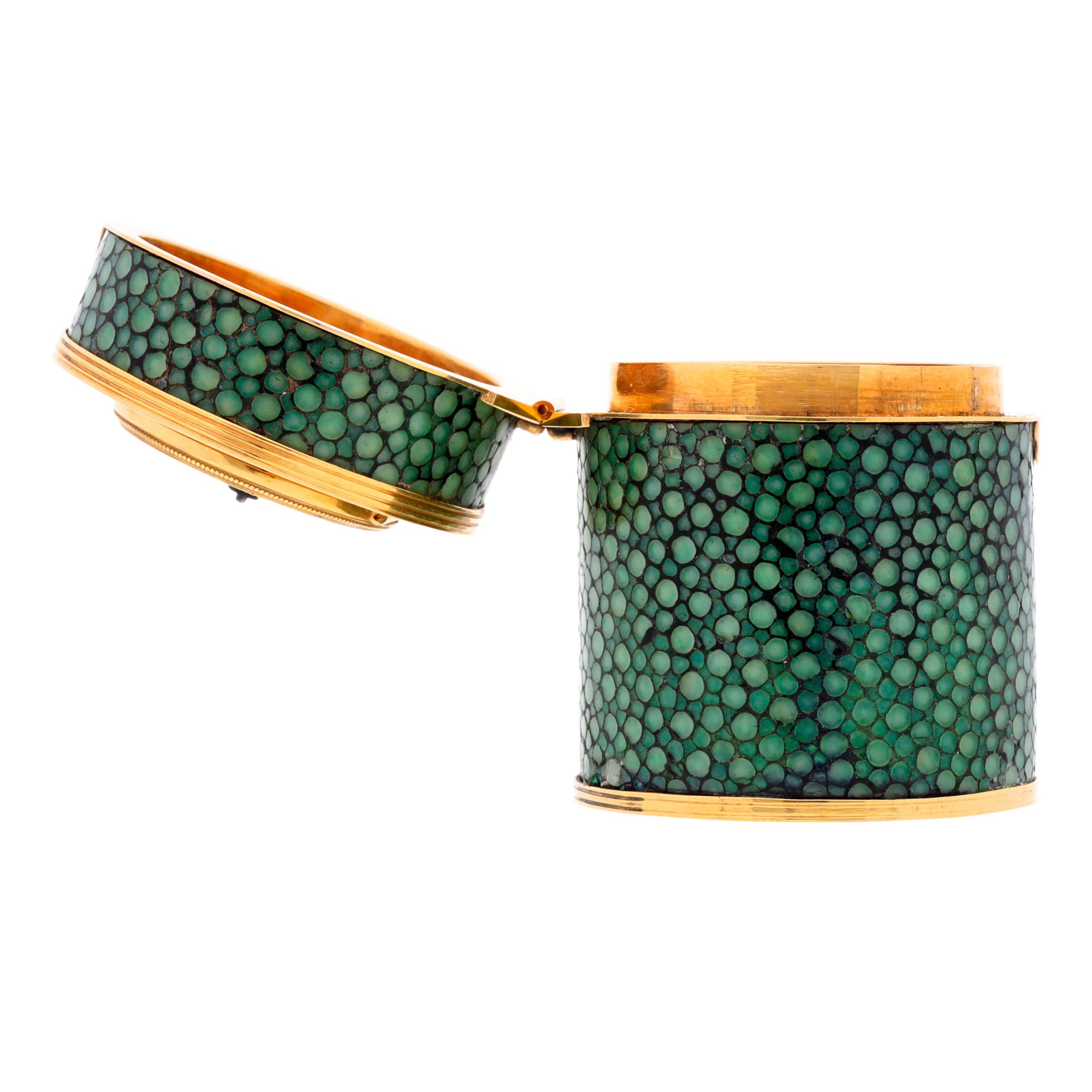 A gold and shagreen cylindrical box with inset watch Circa 1820, no ...