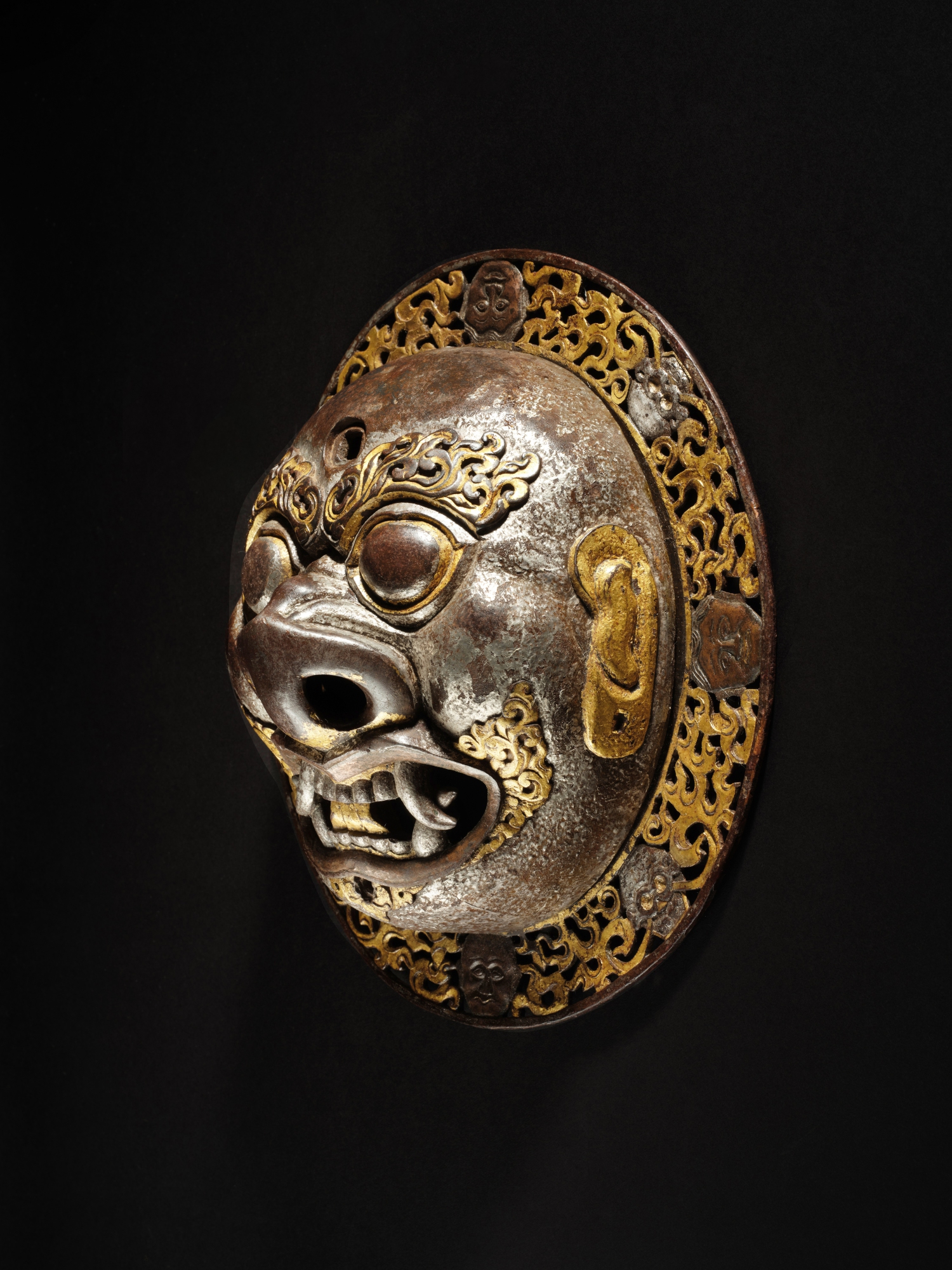 A pair of large gold, silver and copper overlaid iron door bosses ...