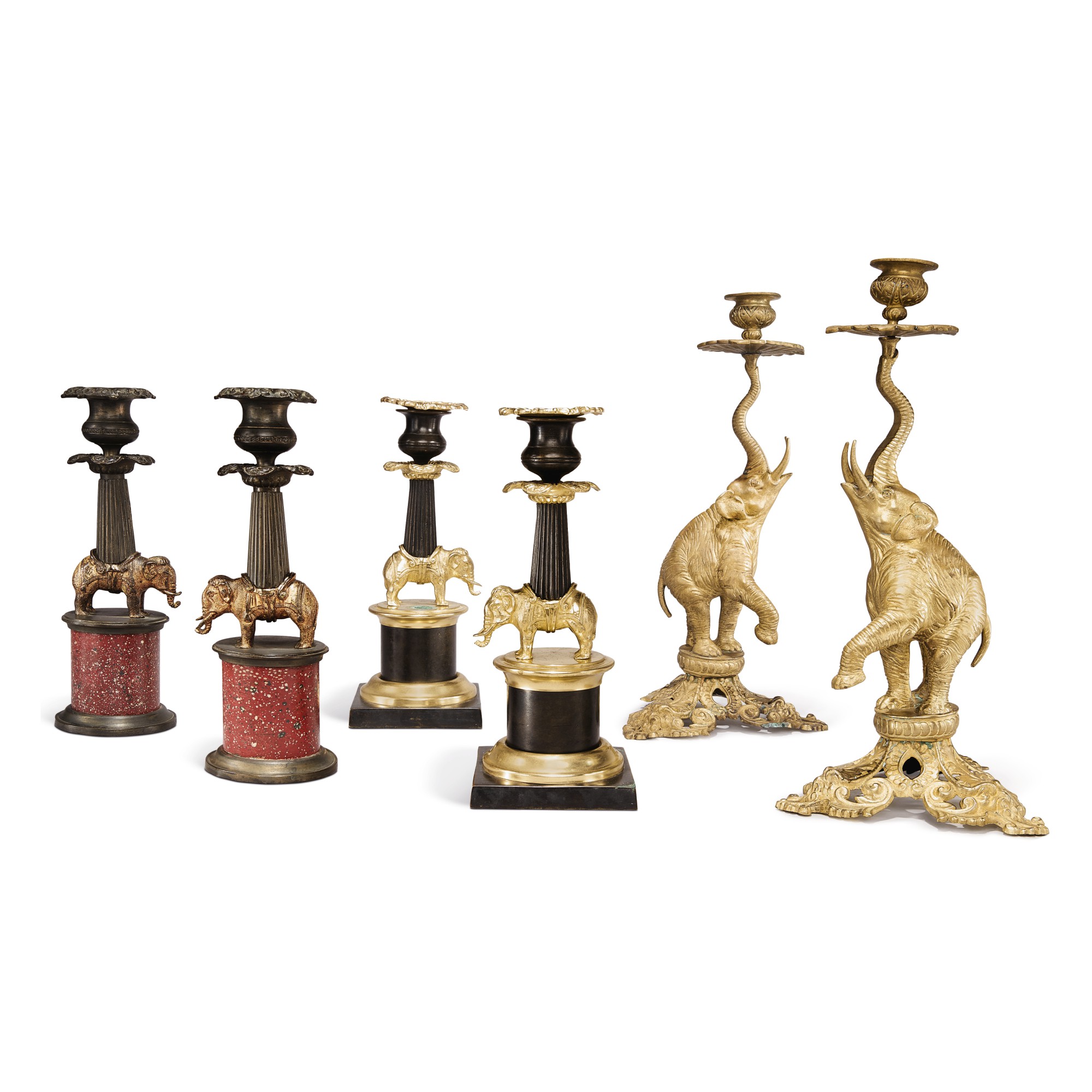 A PAIR OF GILT BRONZE ELEPHANT CANDLESTICKS WITH RAISED TRUNKS ...