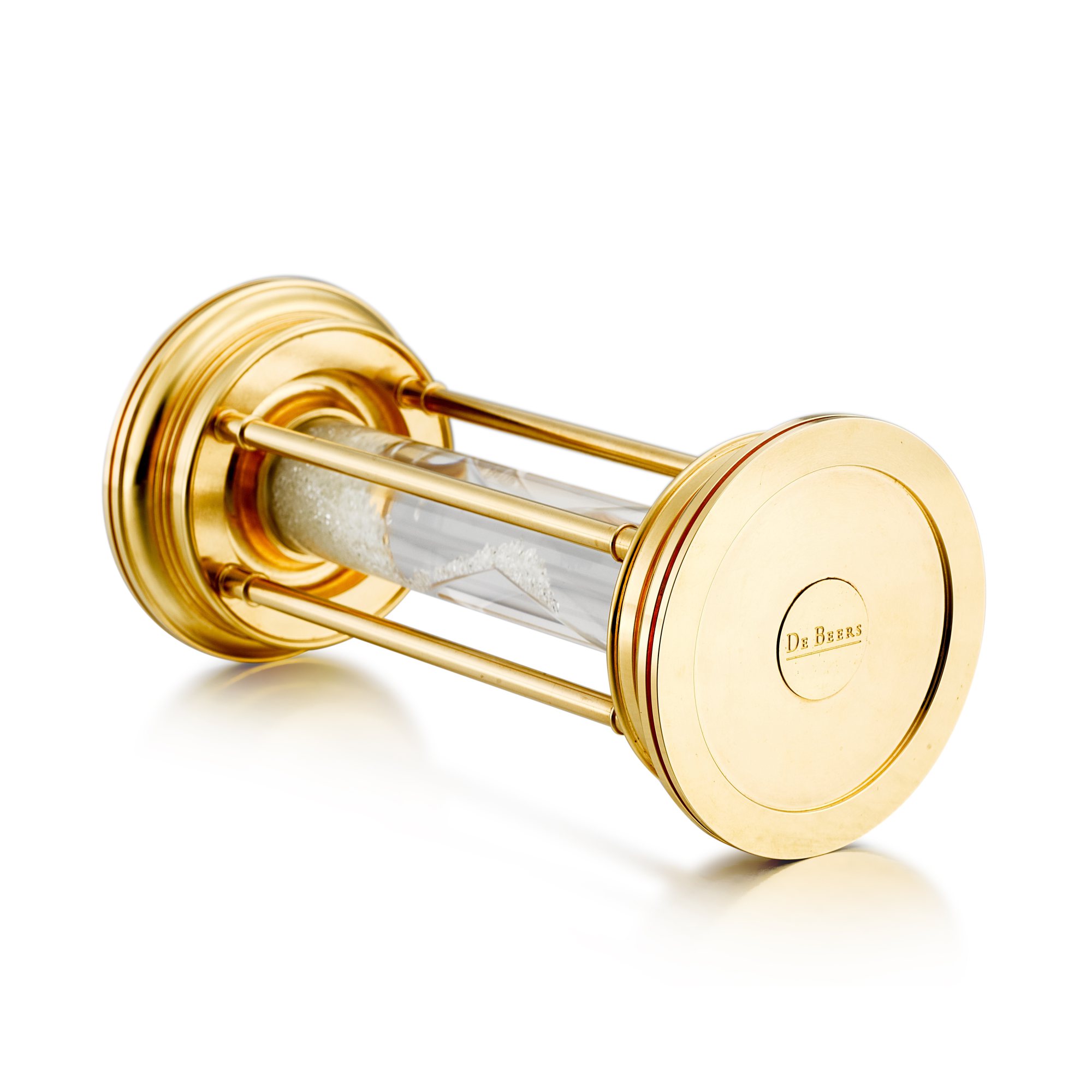 A gilt brass hourglass with floating diamonds, Circa 2000 | 戴比爾斯 ...