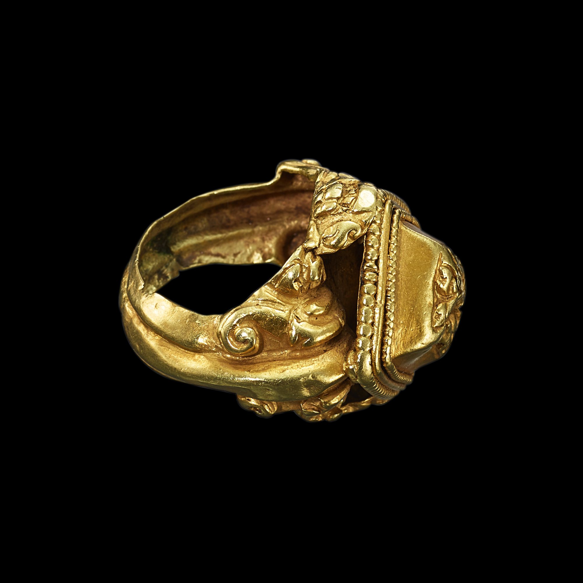 A gold ring with diamond bezel repoussé crowned with flowers Java ...