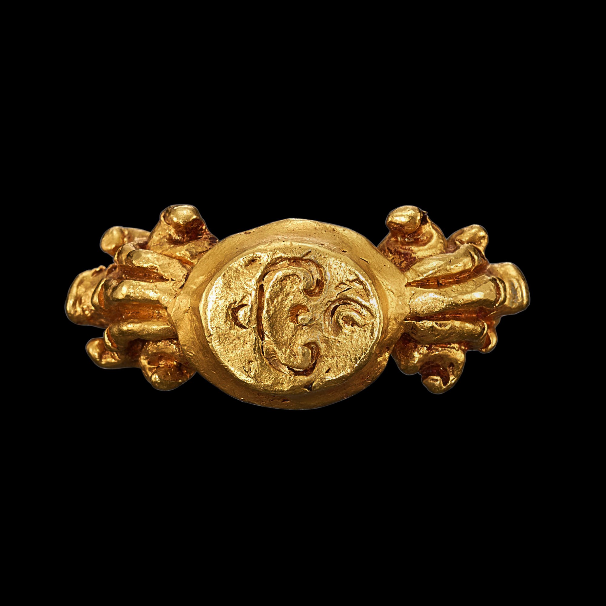 A solid gold ring with an incised bezel of a 'Sri' symbol Java ...