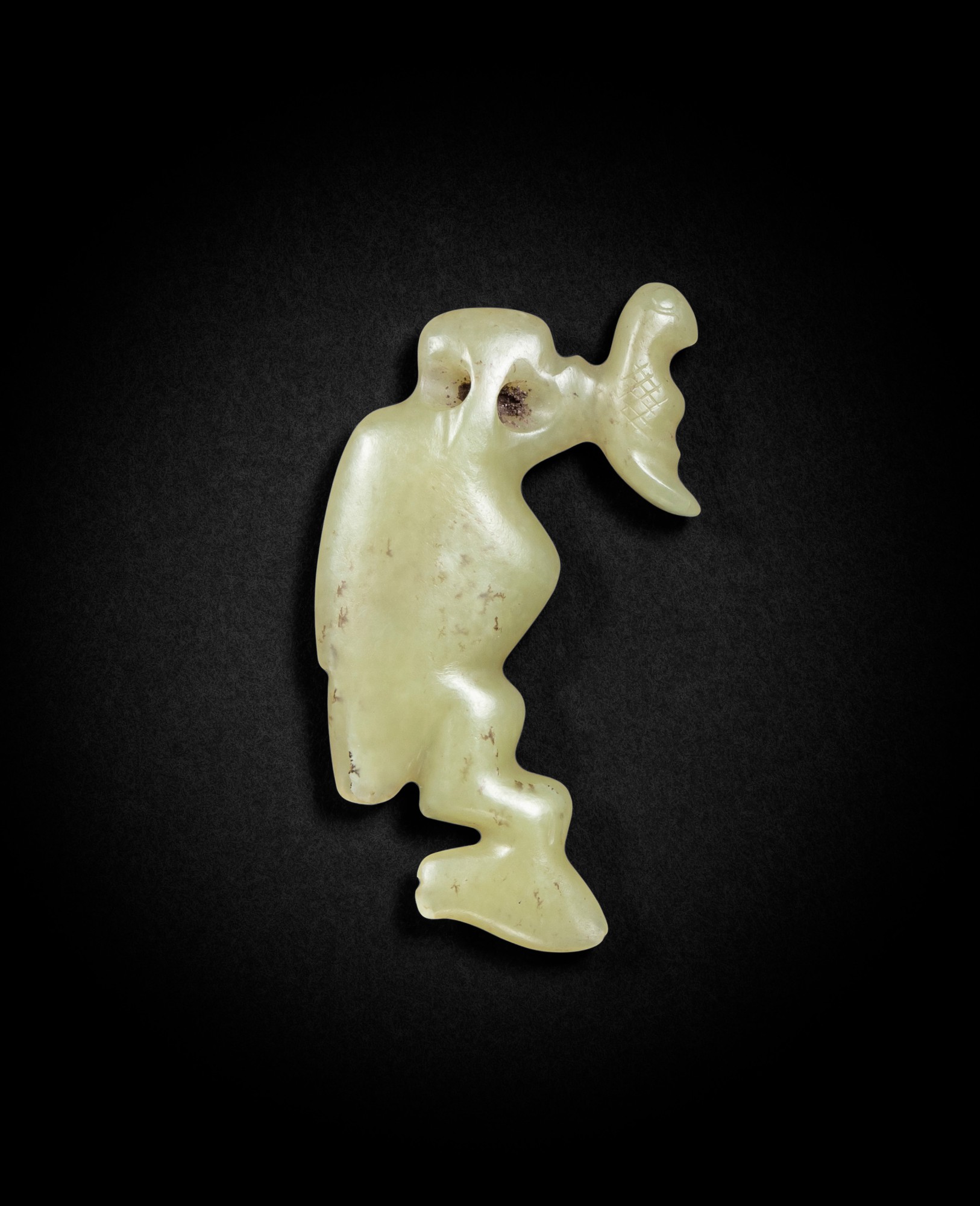 A rare yellowish-green jade 'bird of prey' carving Neolithic period ...