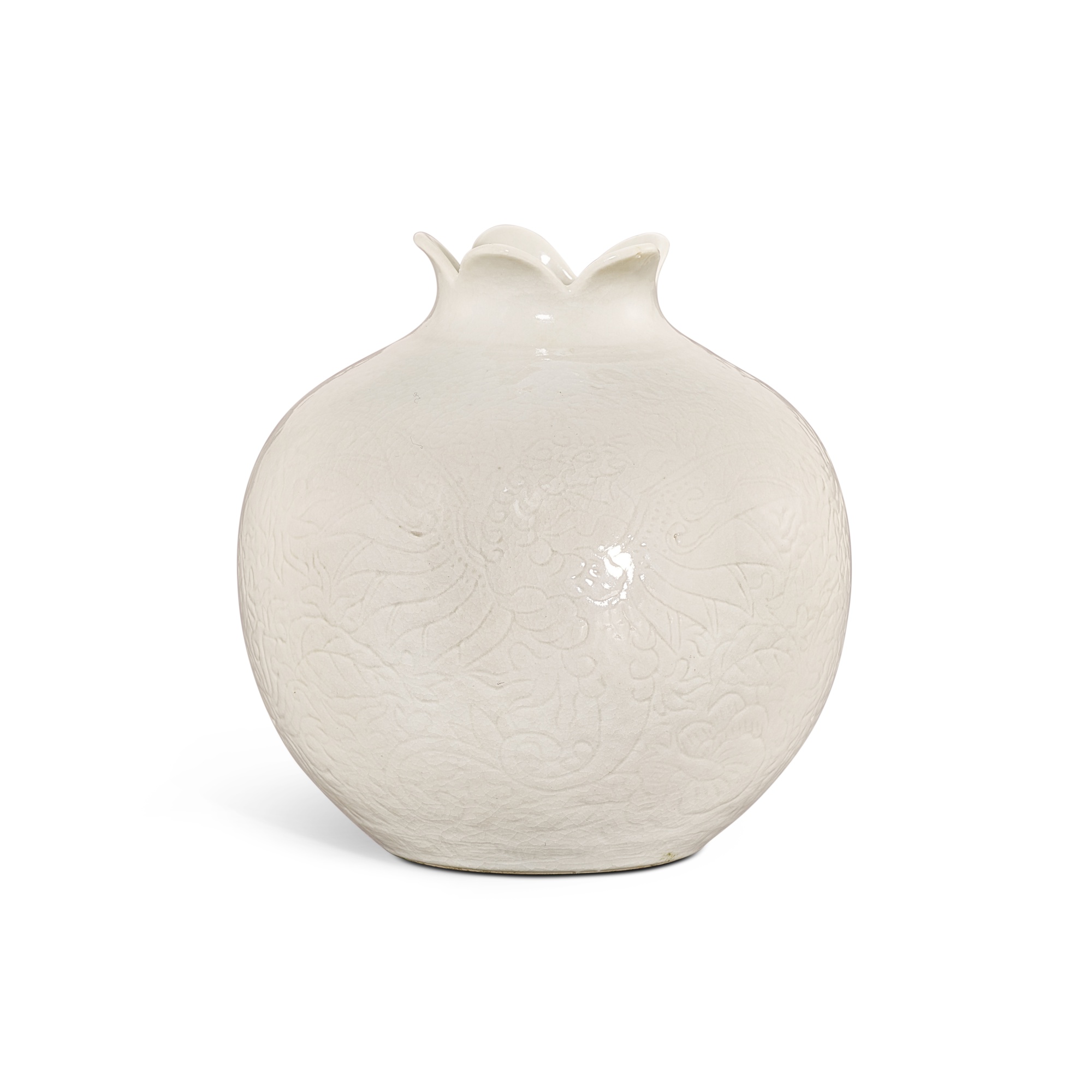 A soft-paste white porcelain carved 'pomegranate' waterpot, Qing ...