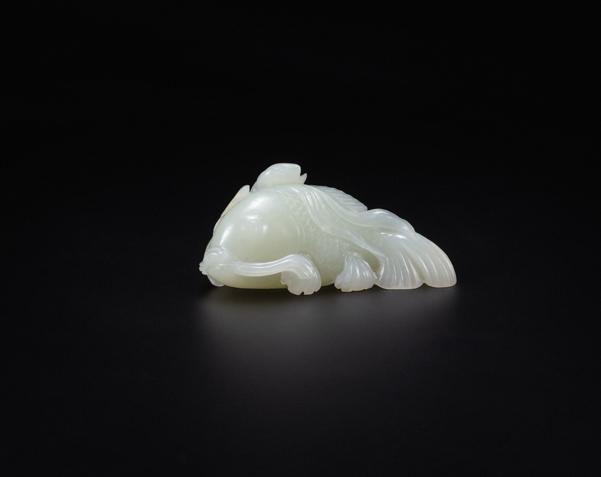A pale celadon jade 'goldfish' carving, Qing dynasty, 19th century ...