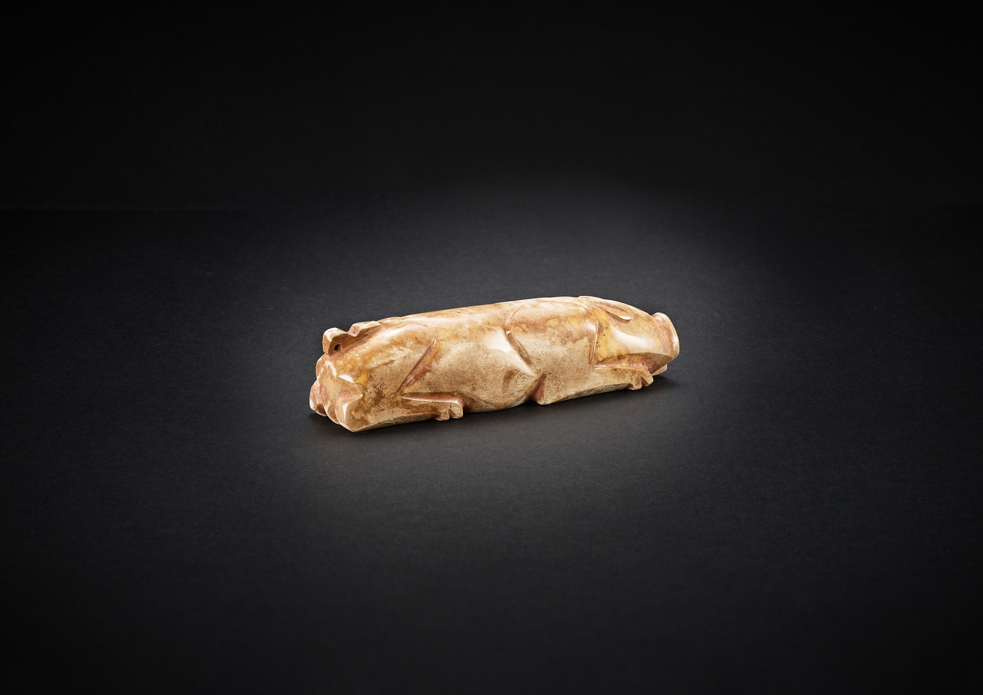 A calcified jade recumbent pig, Western Han dynasty | 西漢 雞骨白玻璃光玉握豬 ...