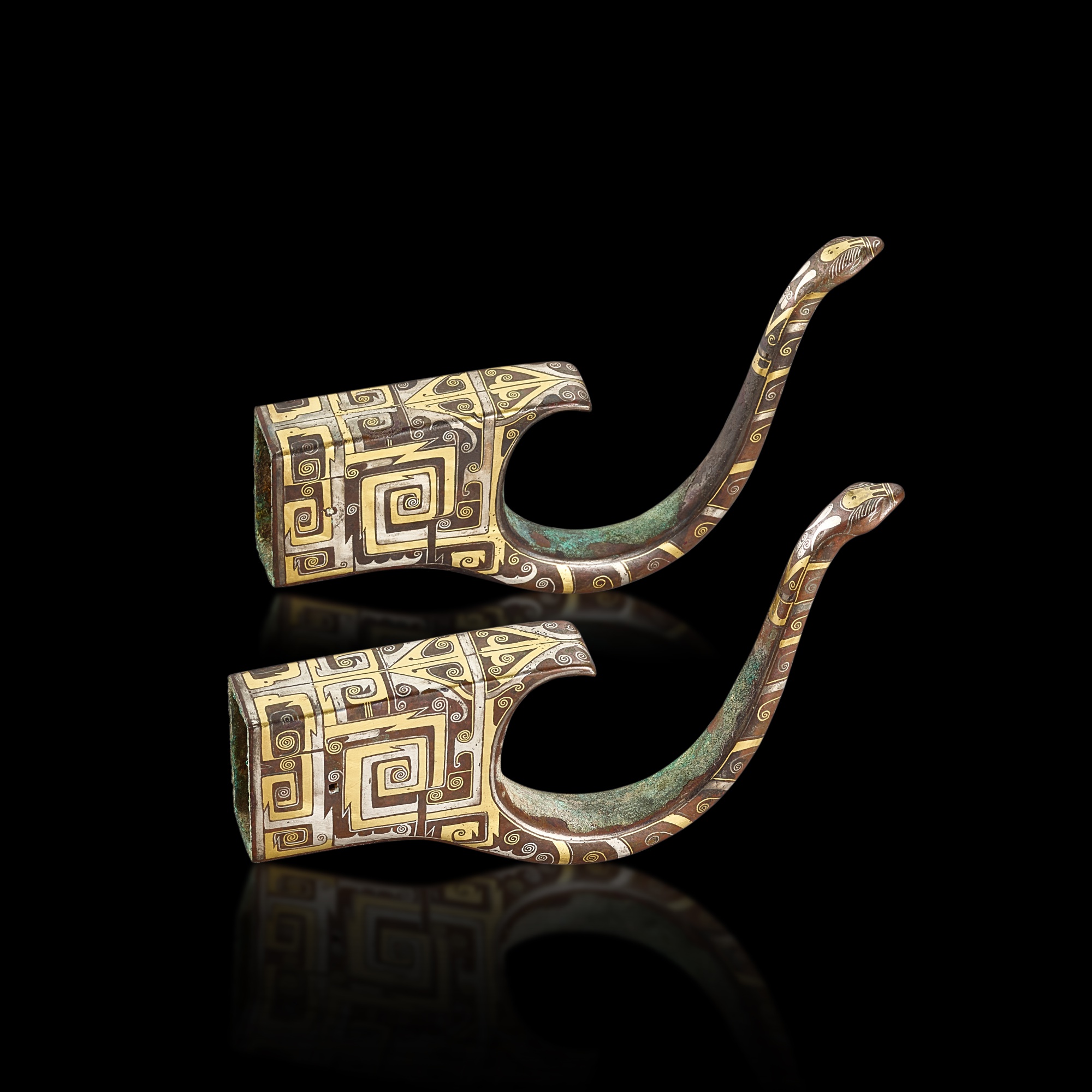 A pair of gold and silver-inlaid bronze crossbow fittings, Eastern Zhou ...
