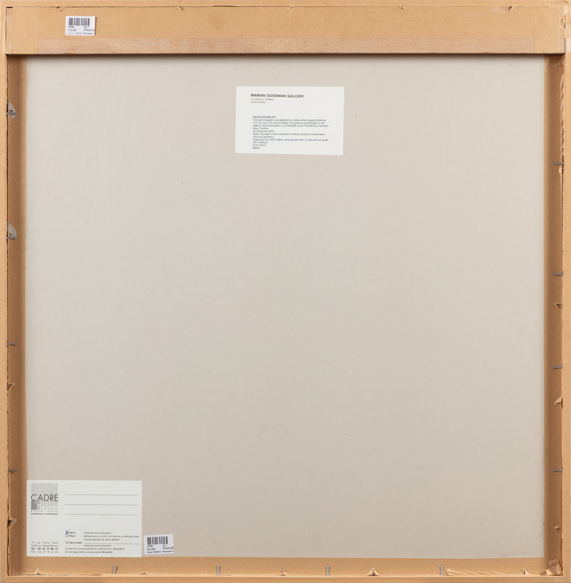 Fernando Augusto Luta washes his clothes while Augusto Mokinda (13), Ze ...