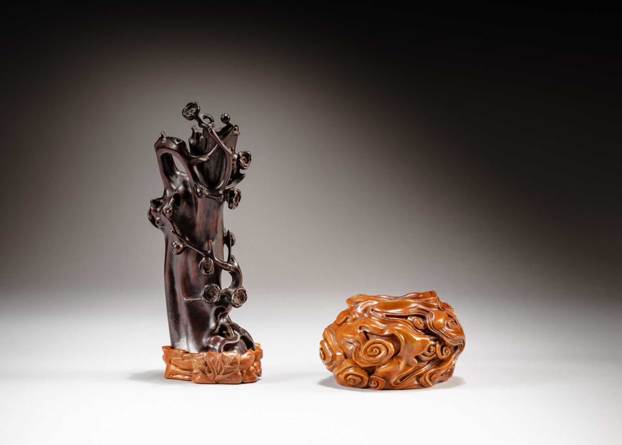 A gnarled boxwood washer and a small carved 'zitan' tree sculpture ...