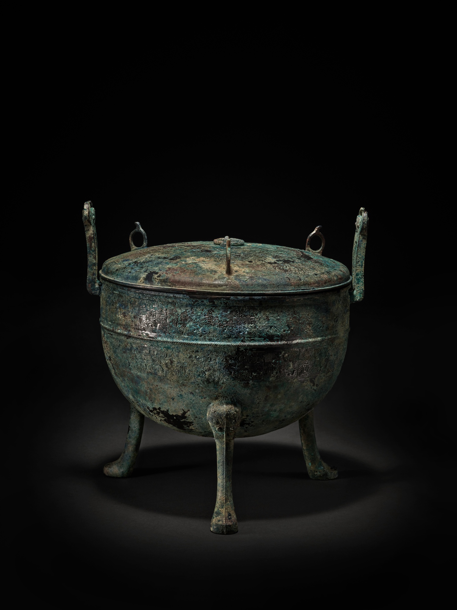 A rare archaic bronze ritual food vessel and cover (Ding), Eastern Zhou ...