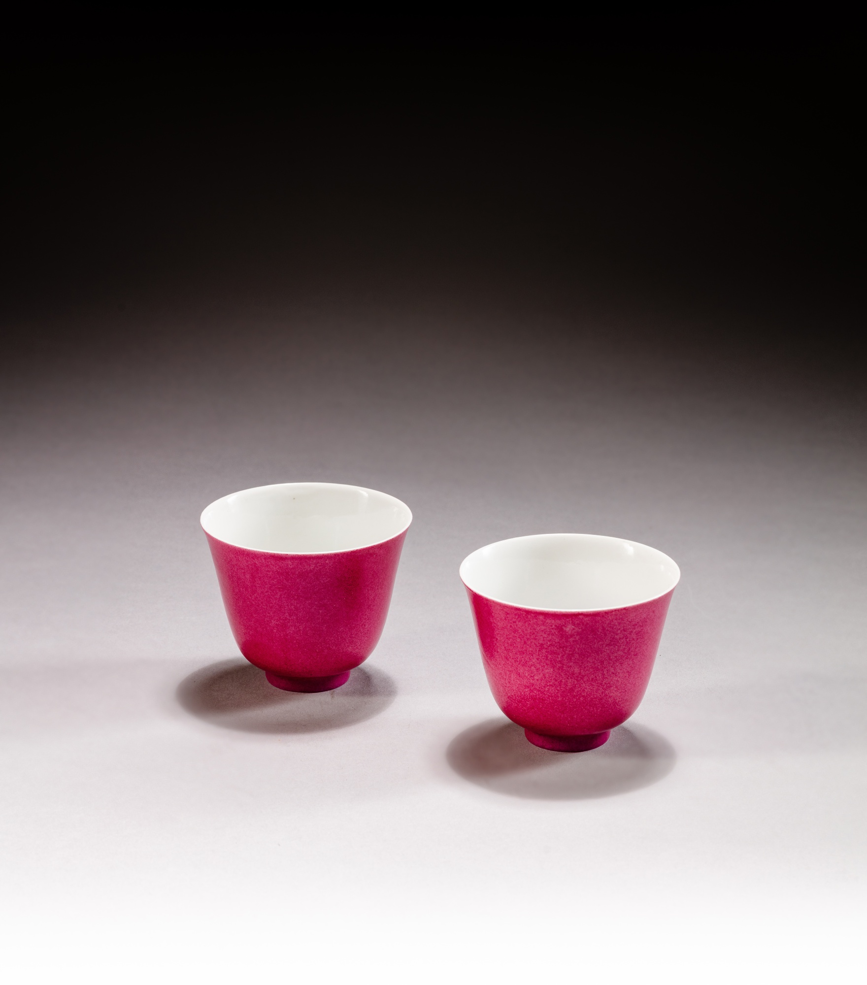 A pair of ruby-pink enameled wine cups, Marks and period of Yongzheng ...