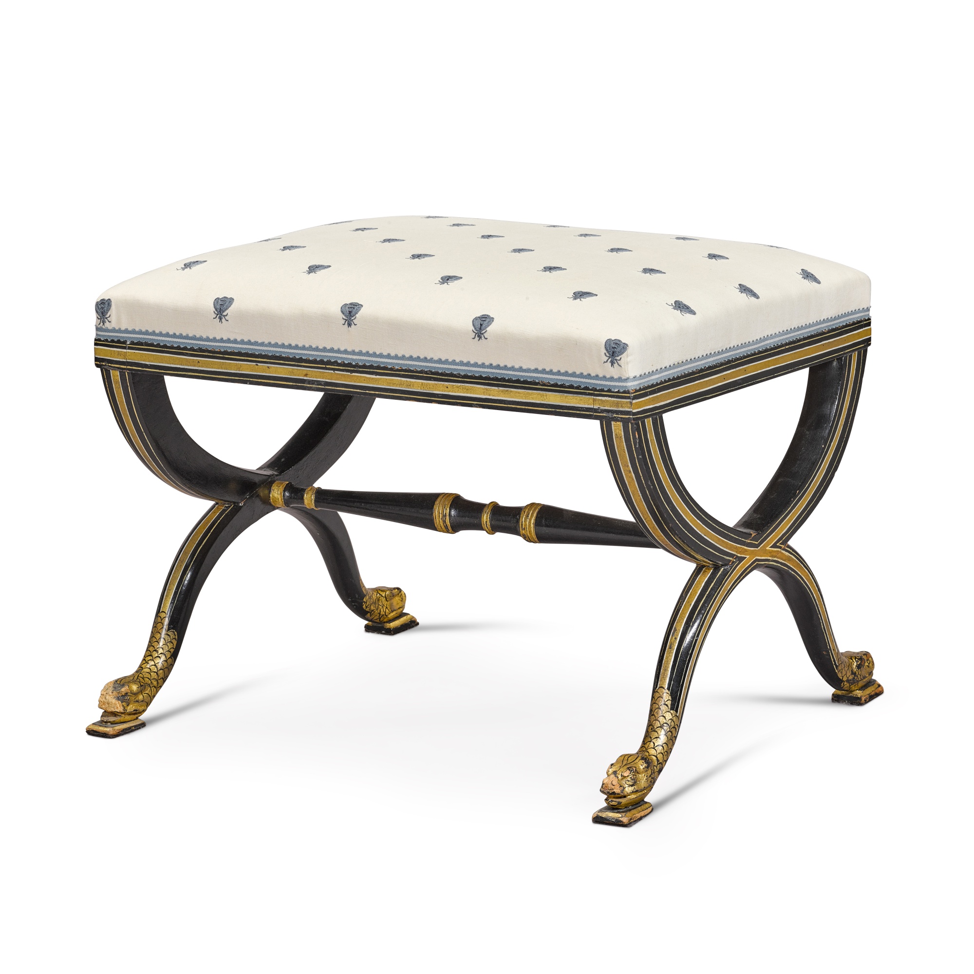 A Regency ebonised and parcel-gilt X-frame stool, early 19th century ...
