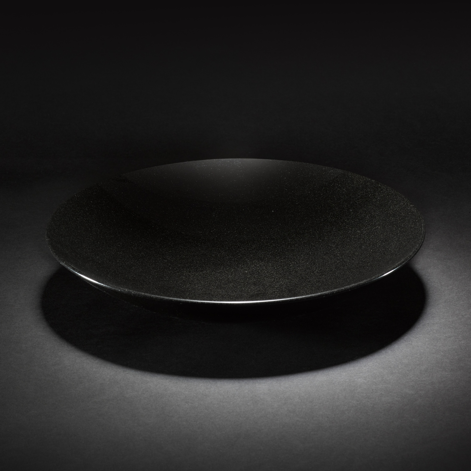 An impressive silver and black granite candlestick and centrepiece bowl ...