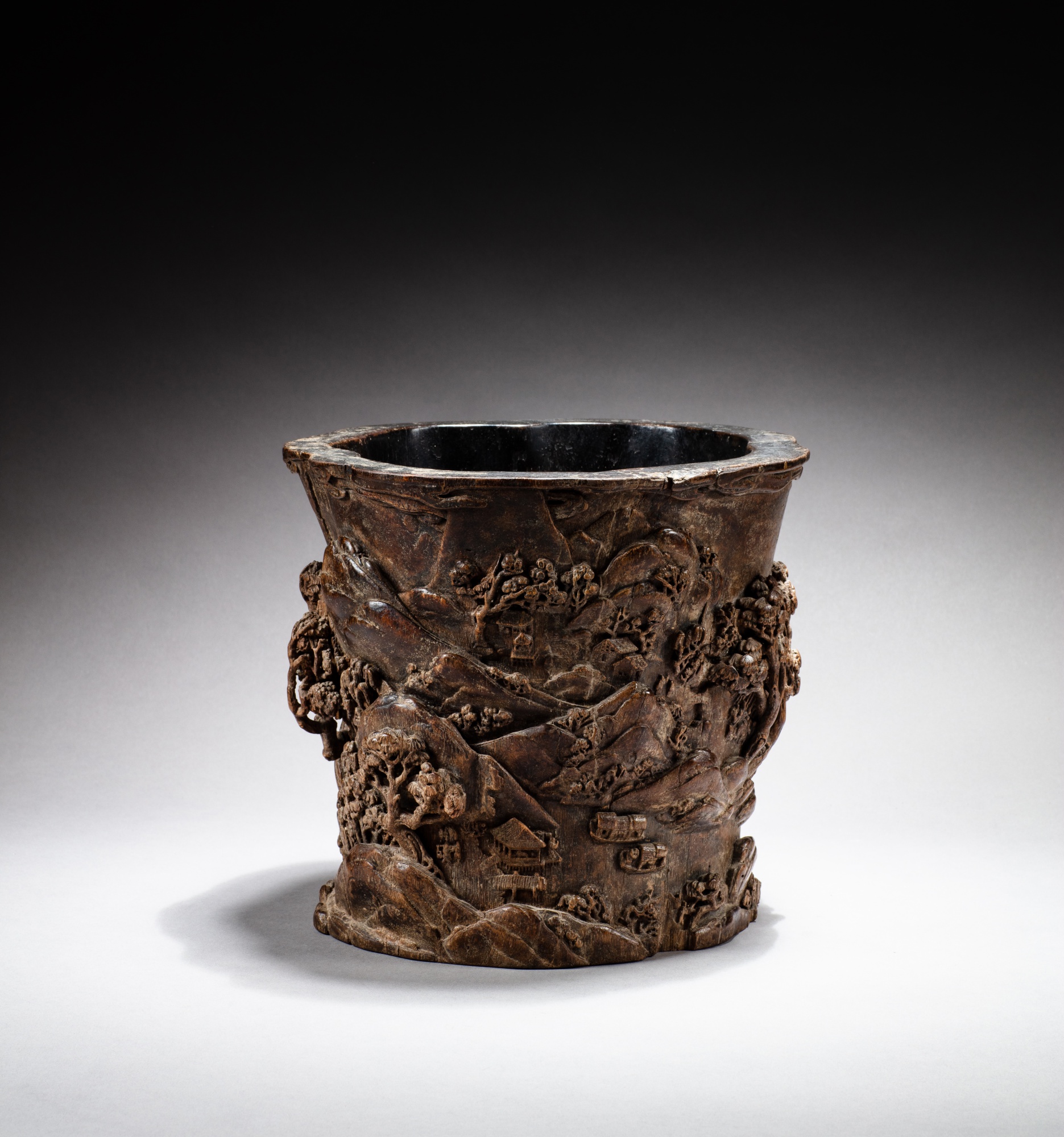 A chenxiangmu 'landscape' brushpot, Qing dynasty, 18th century | 清十八世紀 沉香木雕山水圖筆筒 | Asian Arts ...