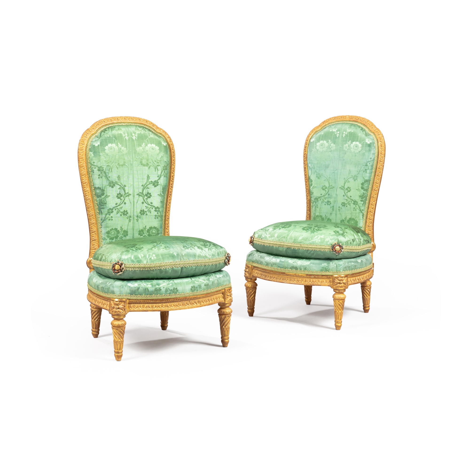 A pair of Louis XVI giltwood chauffeuses, circa 1780, stamped by Claude ...