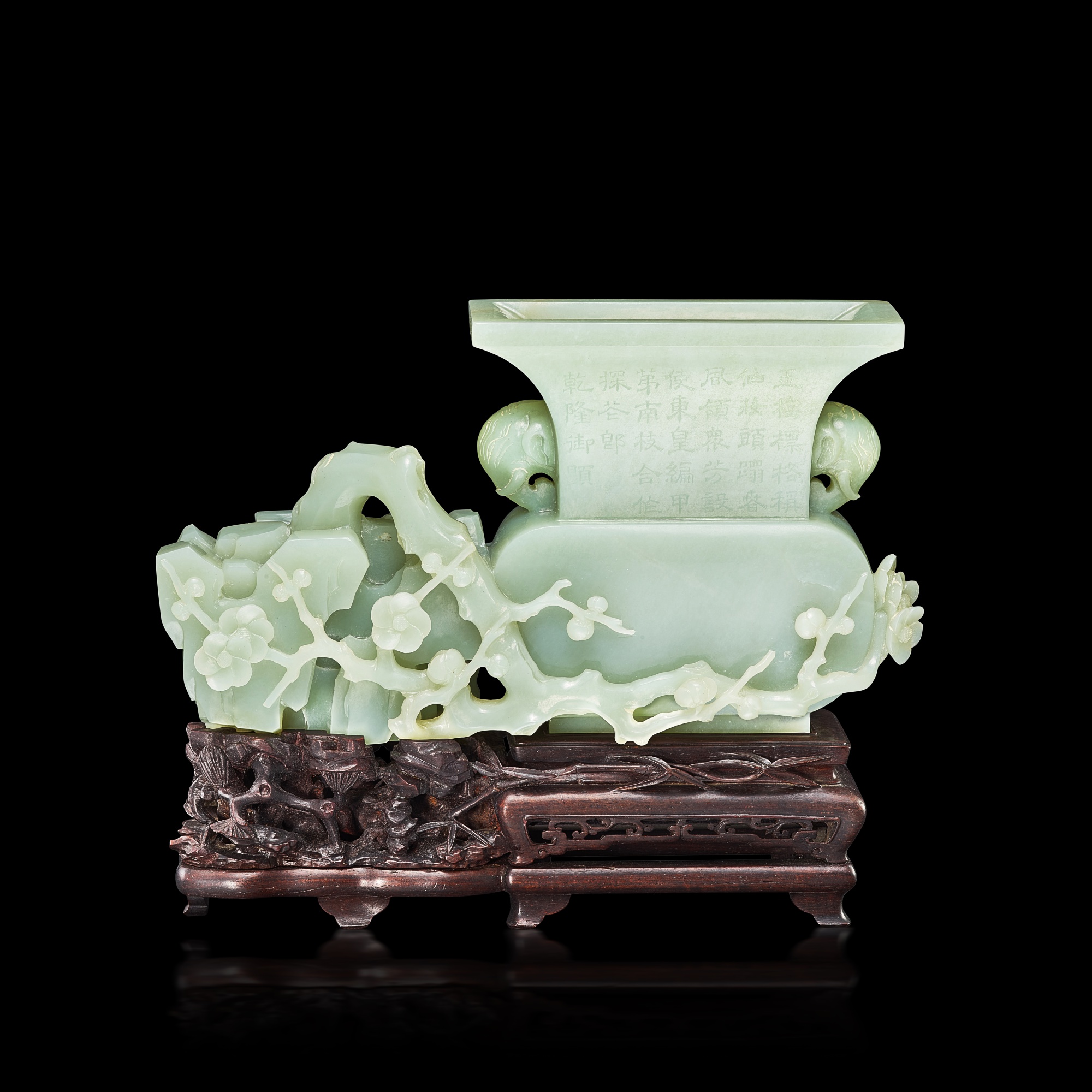 A very rare imperial inscribed pale celadon jade 'prunus' vase with ...
