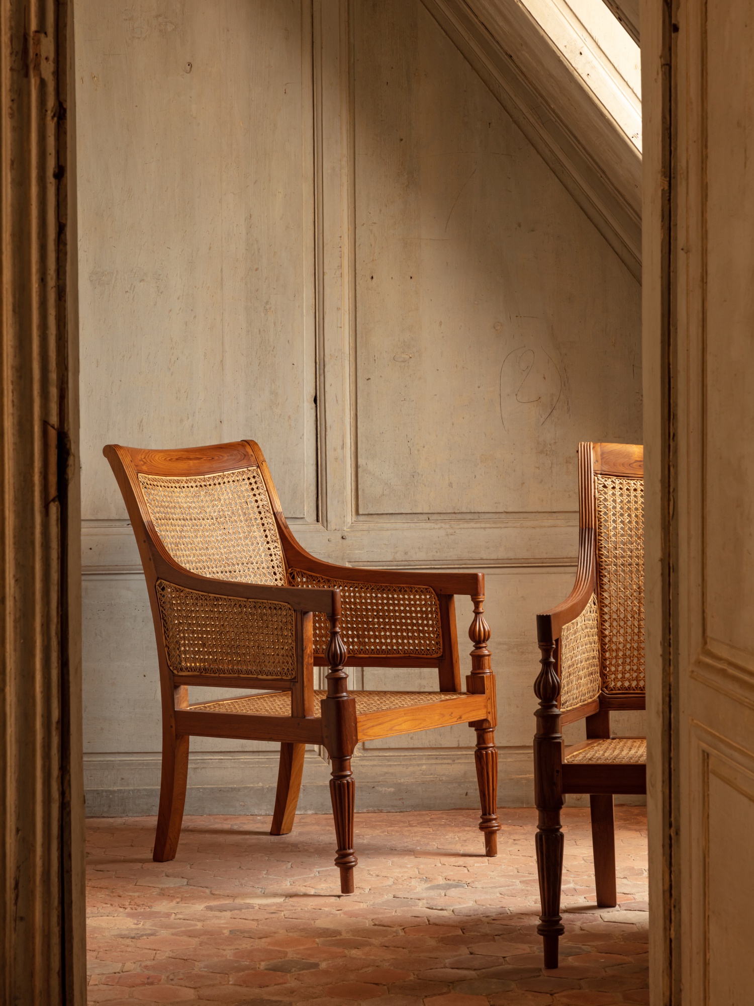 A pair of teak caned library chairs, 20th century | Paire de fauteuils ...