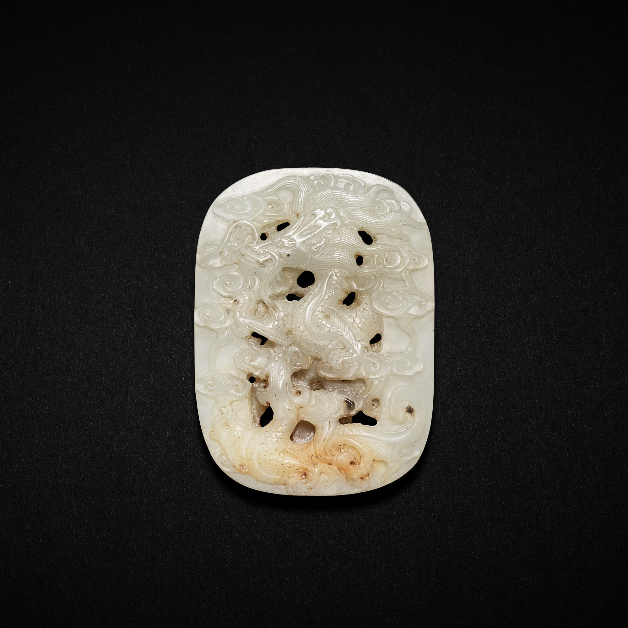 A celadon-white jade reticulated 'dragon and tiger' plaque, Qing ...