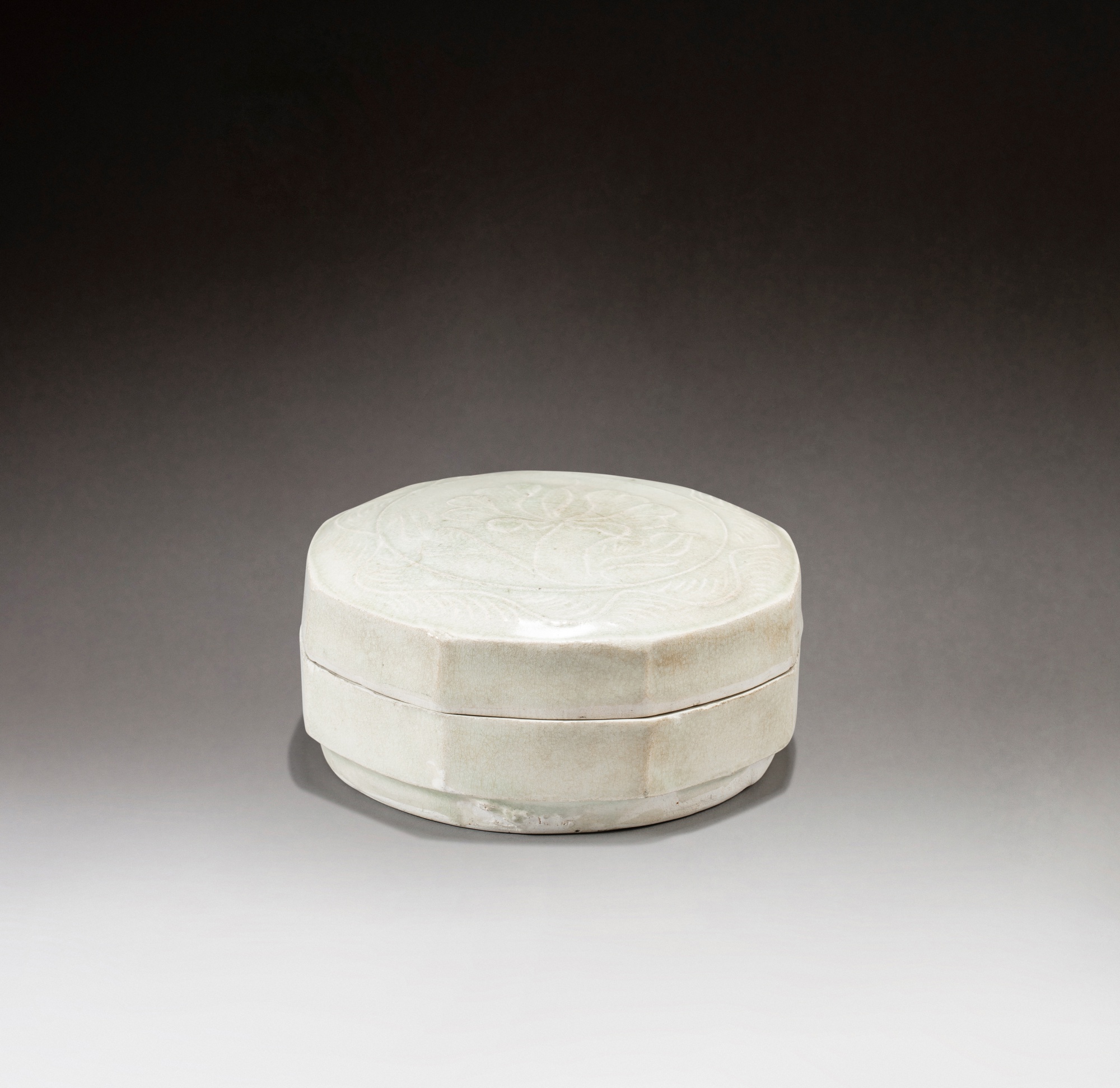 A cream-glazed octagonal powder box and cover, Southern Song dynasty ...
