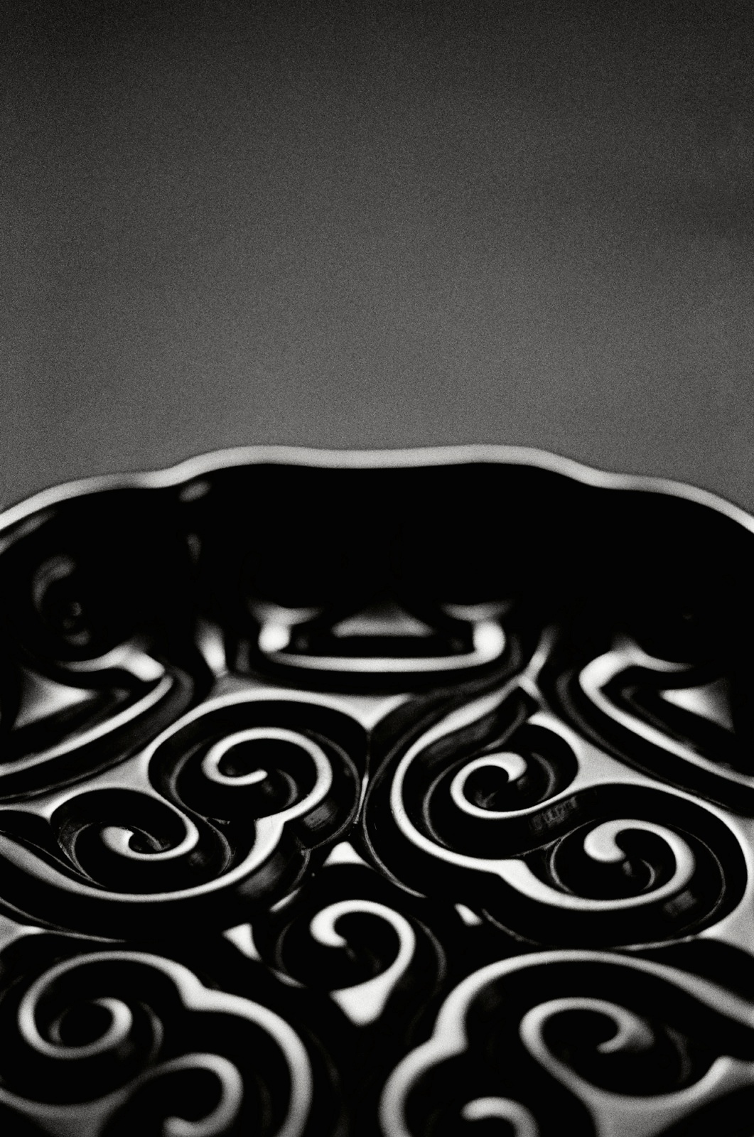An extremely rare and finely carved black 'tixi' lacquer lobed dish ...