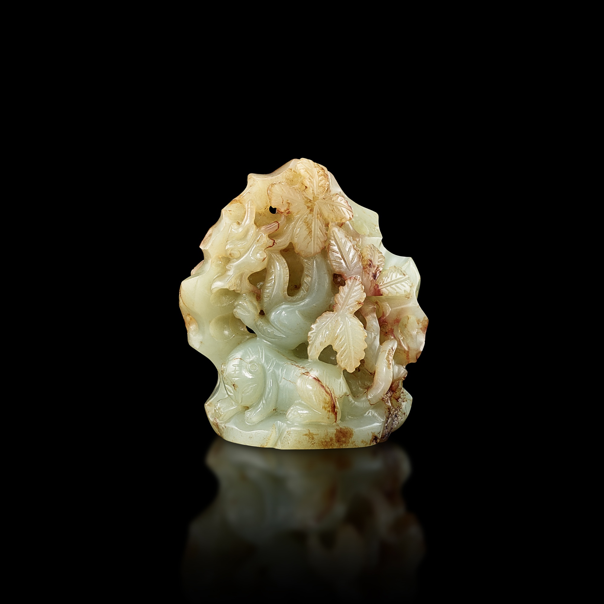 A reticulated celadon and russet jade 'dragon and tiger' boulder, Ming ...