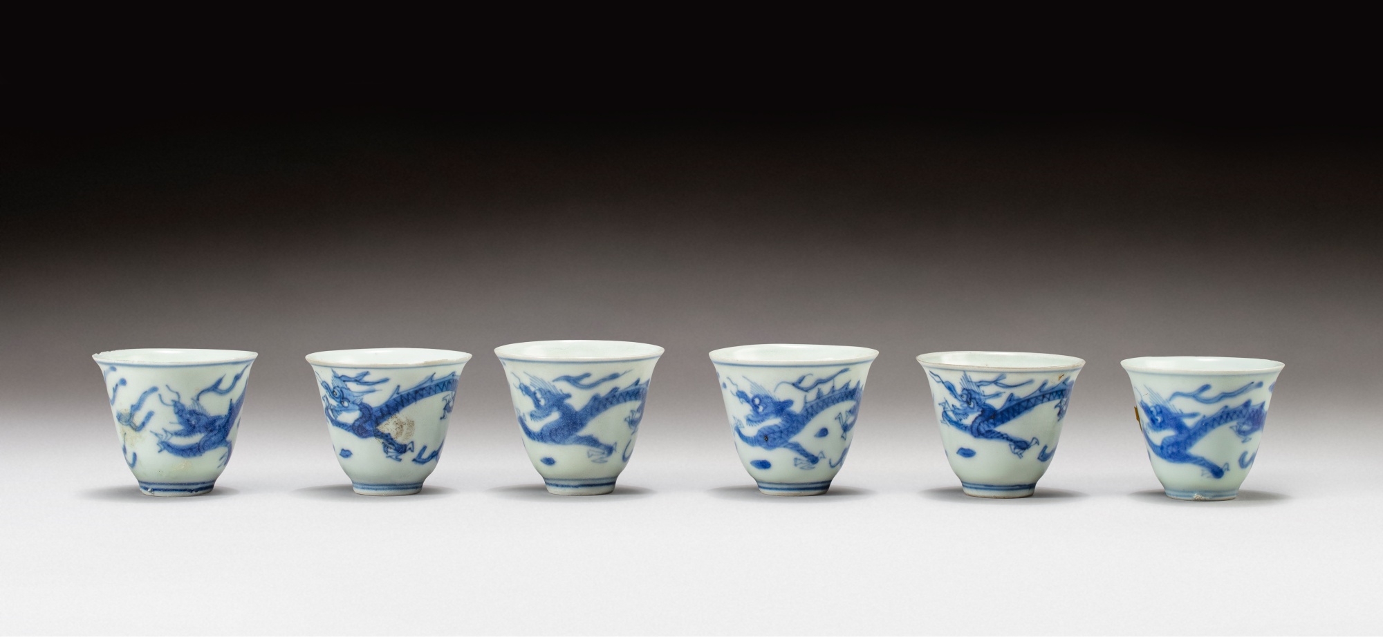 A group of six blue and white 'dragon' wine cups, Transitional period ...