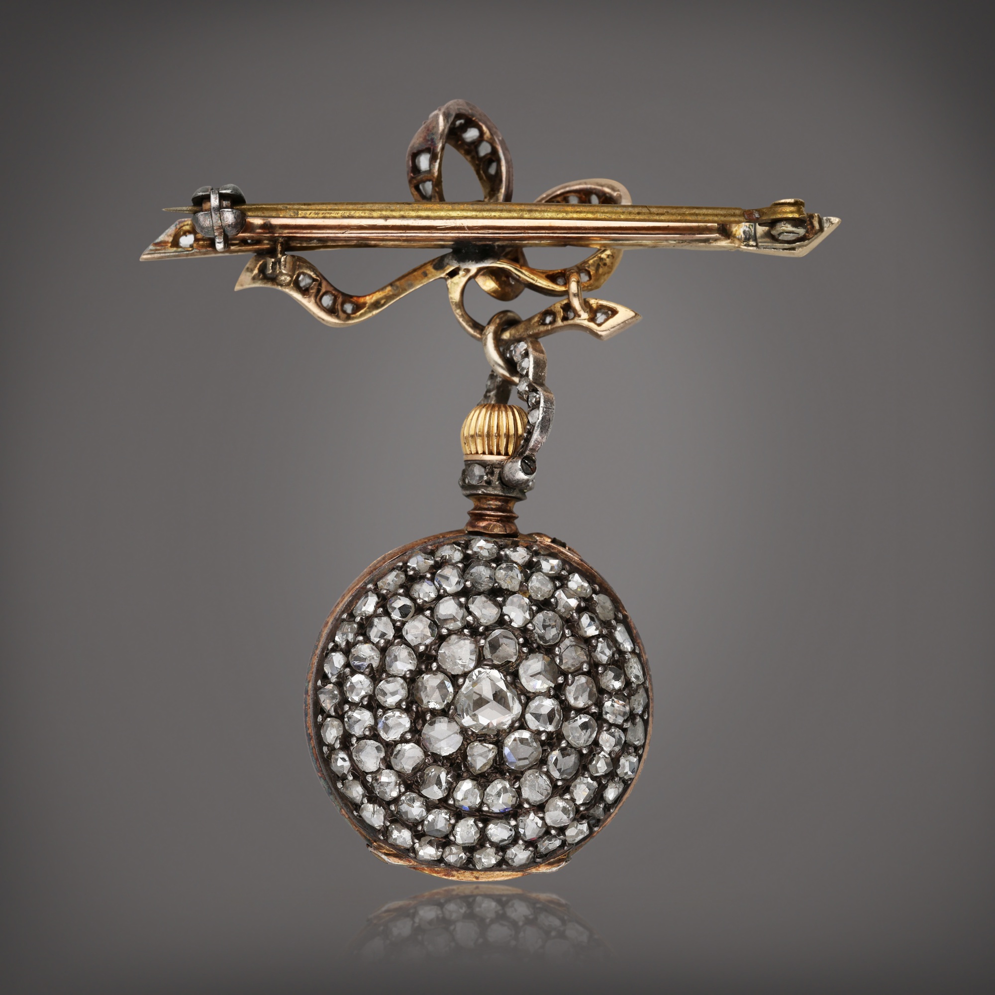 A Miniature pink gold and diamond and ruby-set open faced brooch watch ...