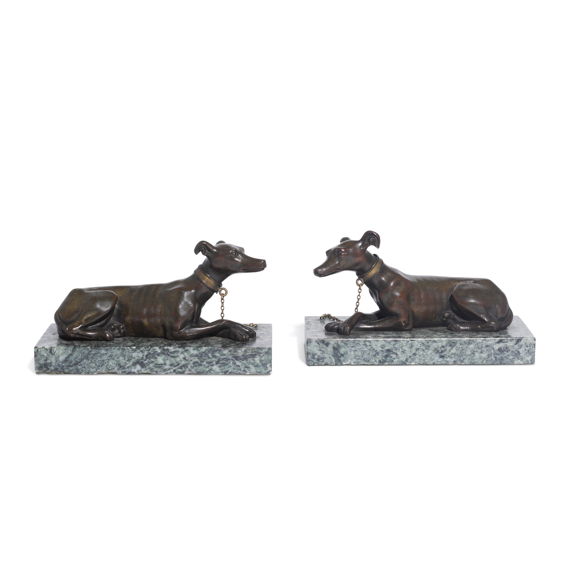 A pair of Regency bronze models of recumbent greyhounds, first quarter ...