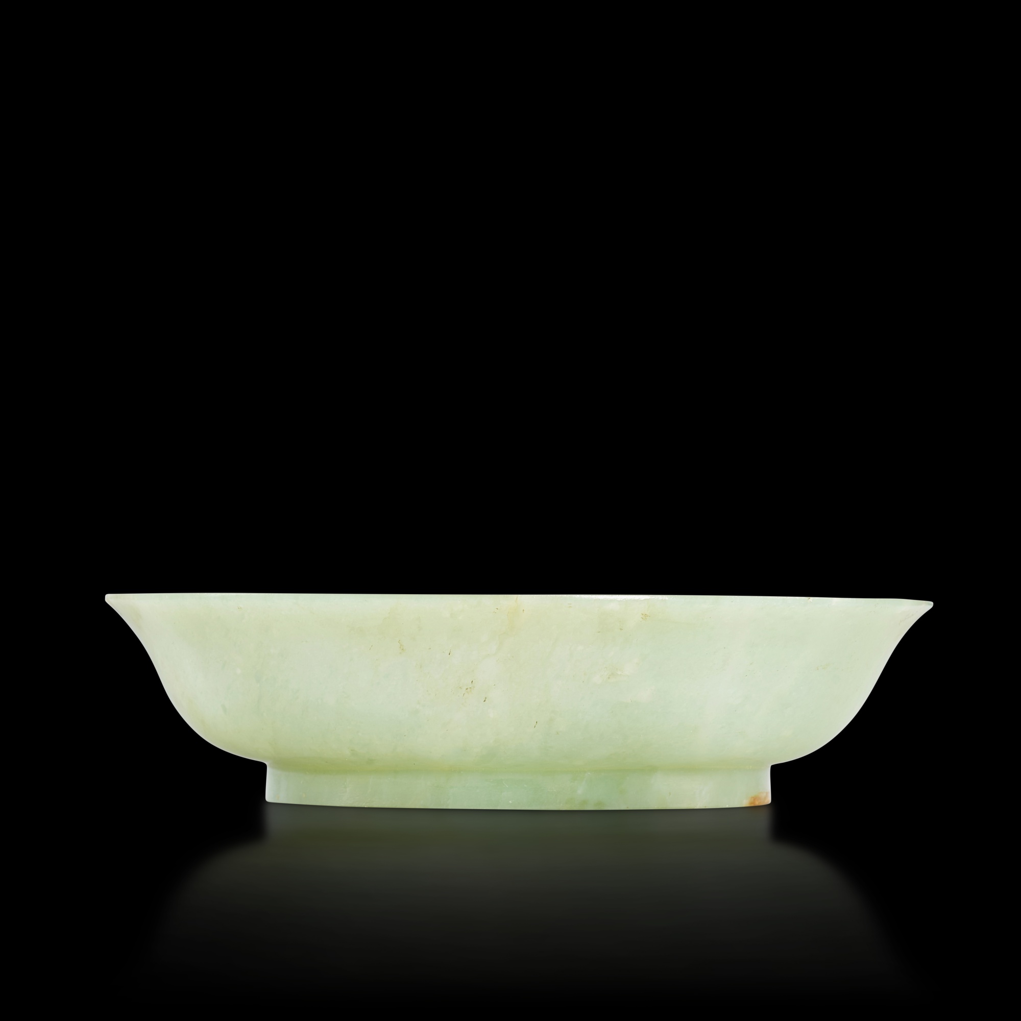 A pale celadon and russet jade dish, Qing dynasty 清 青白玉光素撇口盤 ...