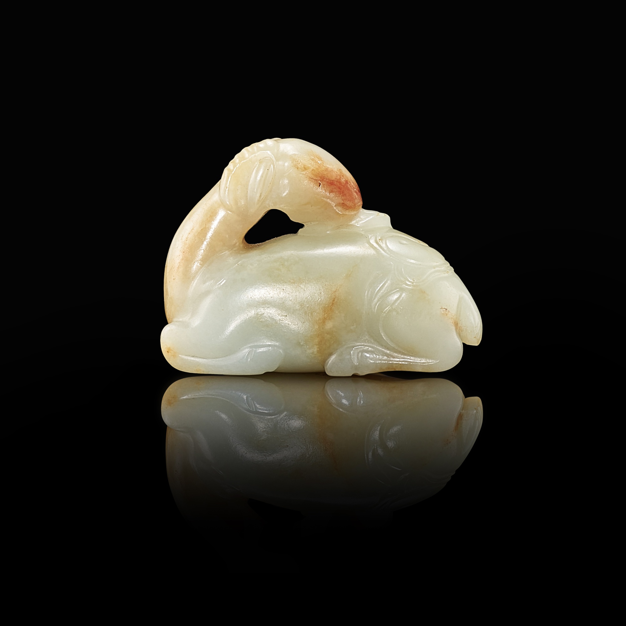 A white and russet jade 'ram and lingzhi' group, Ming dynasty or ...