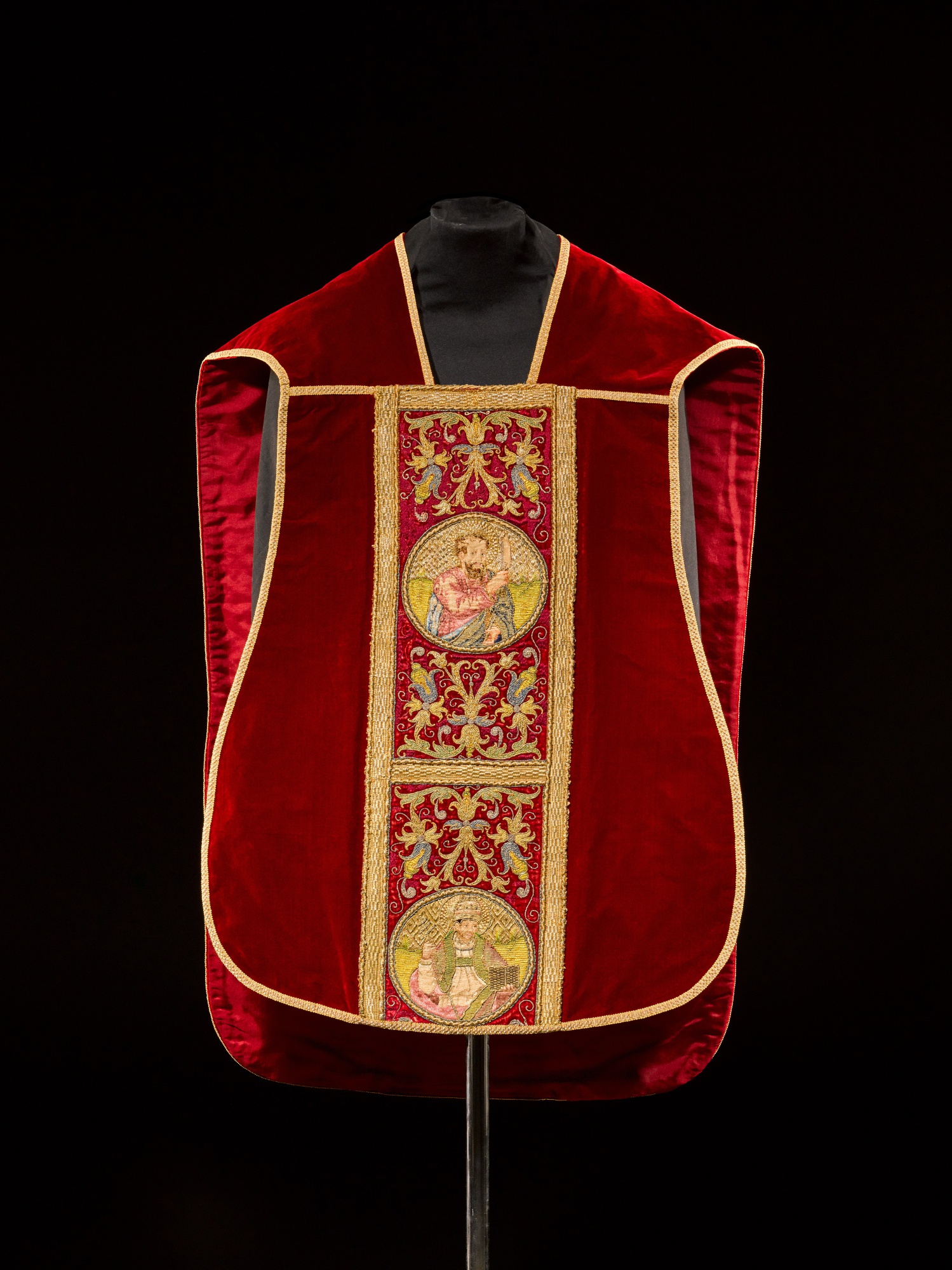 A claret, embroidered and metal-thread velvet chasuble with other ...