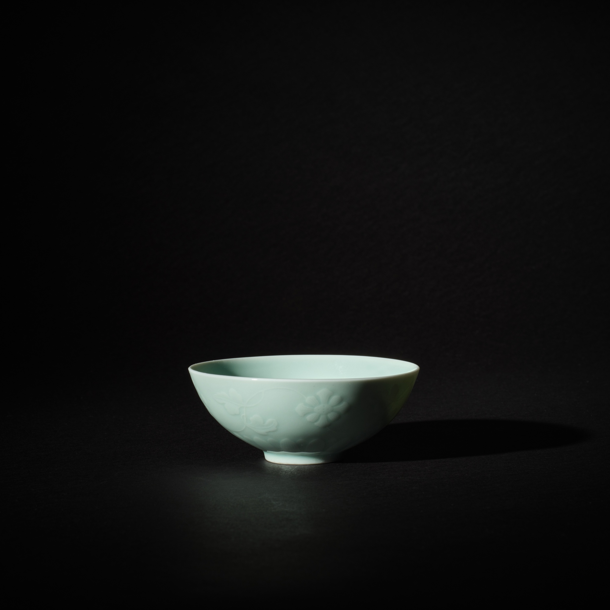 A fine molded celadon-glazed 'floral' bowl, Mark and period of ...