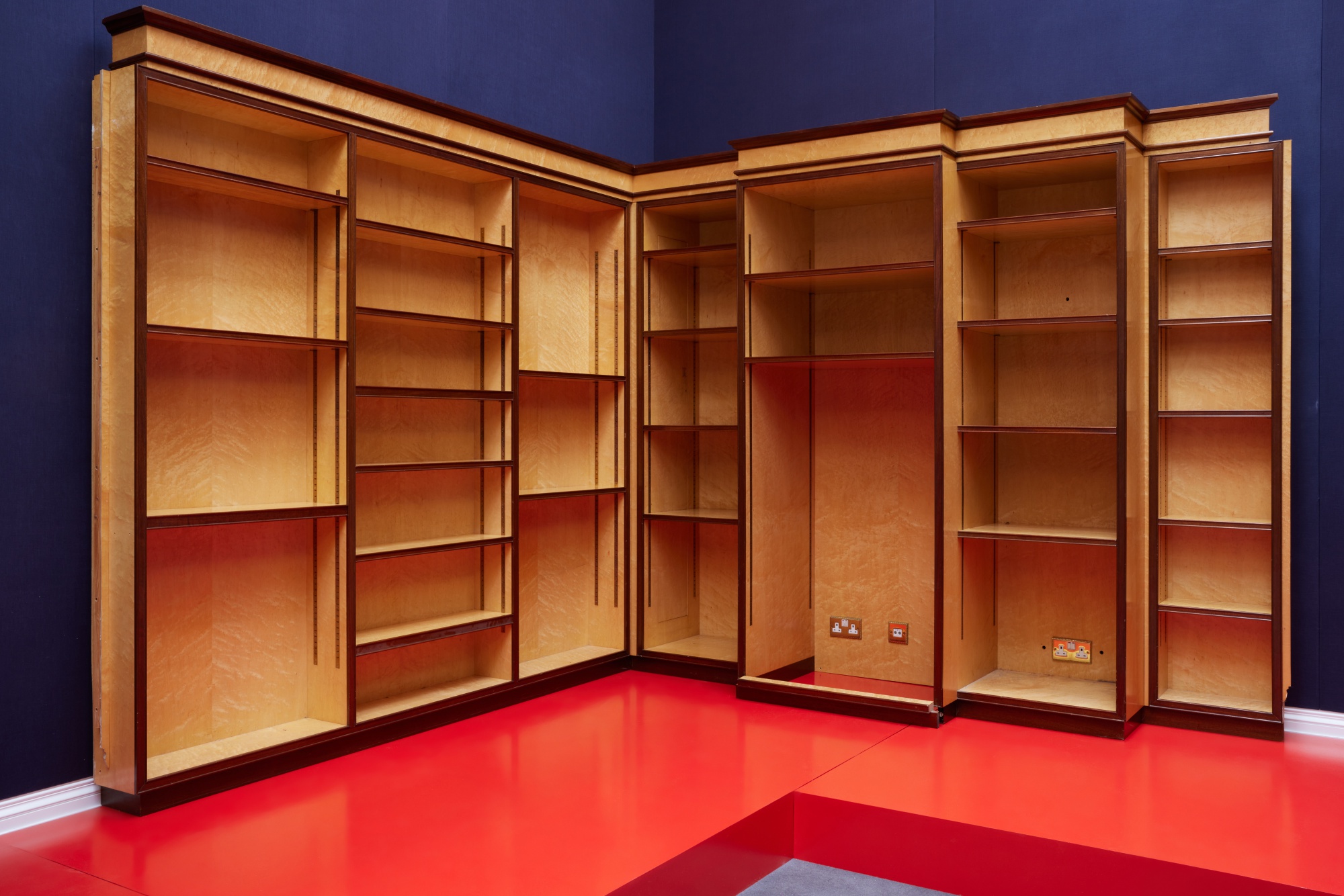 A bird's eye maple and mahogany fitted bookcase with adjustable shelves ...
