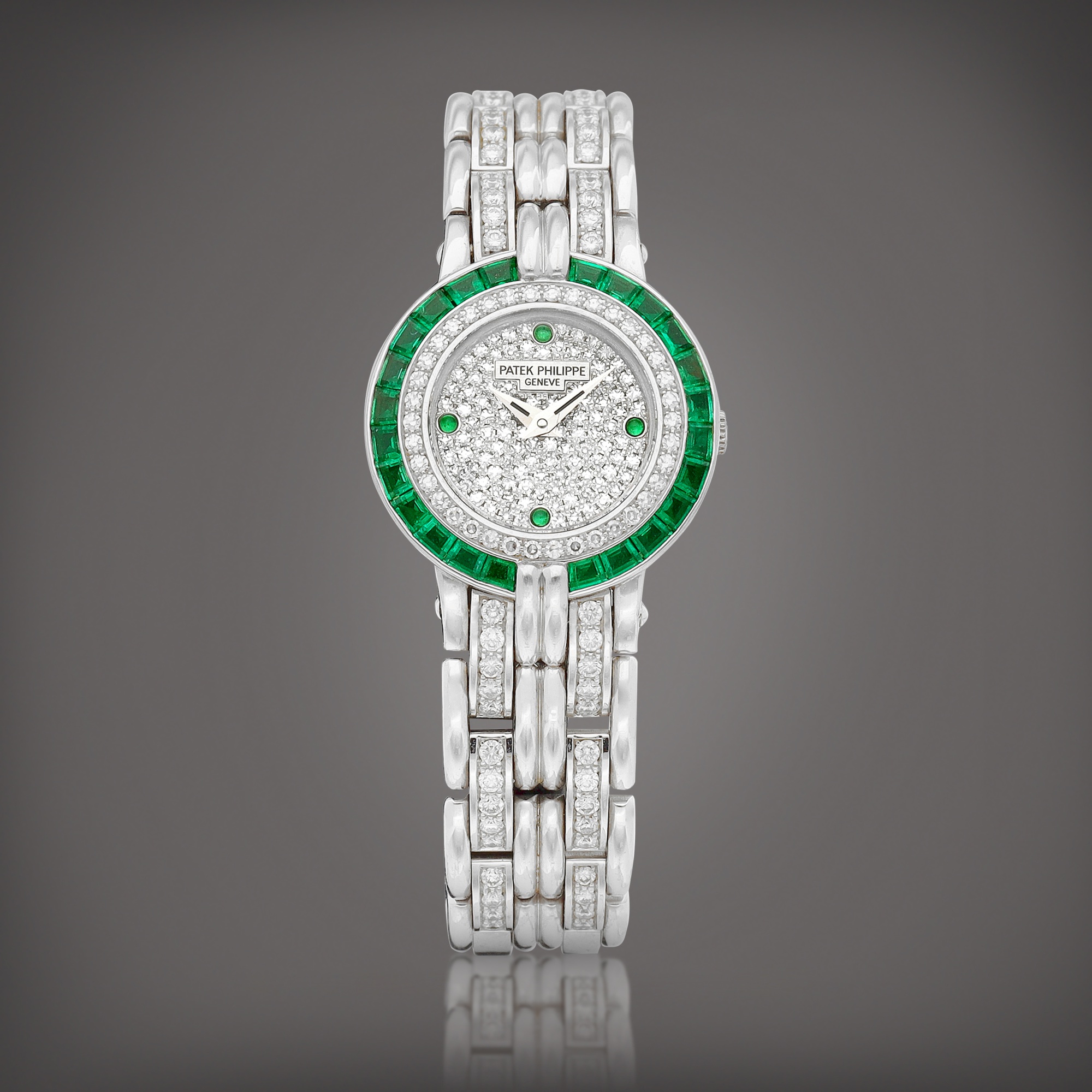 Reference 4782 | A white gold, diamond and emerald-set bracelet watch ...