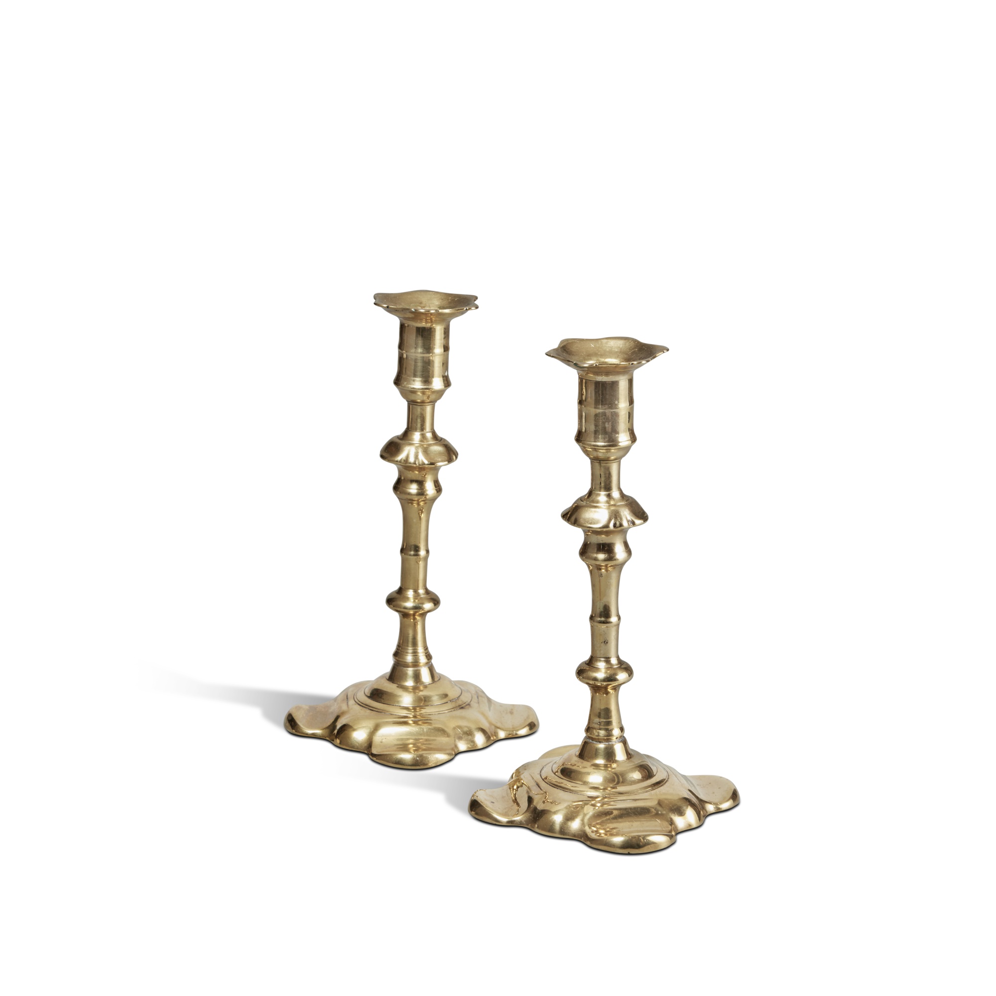 A Pair of English Cast-Brass Petal-Base Candlesticks, probably by ...