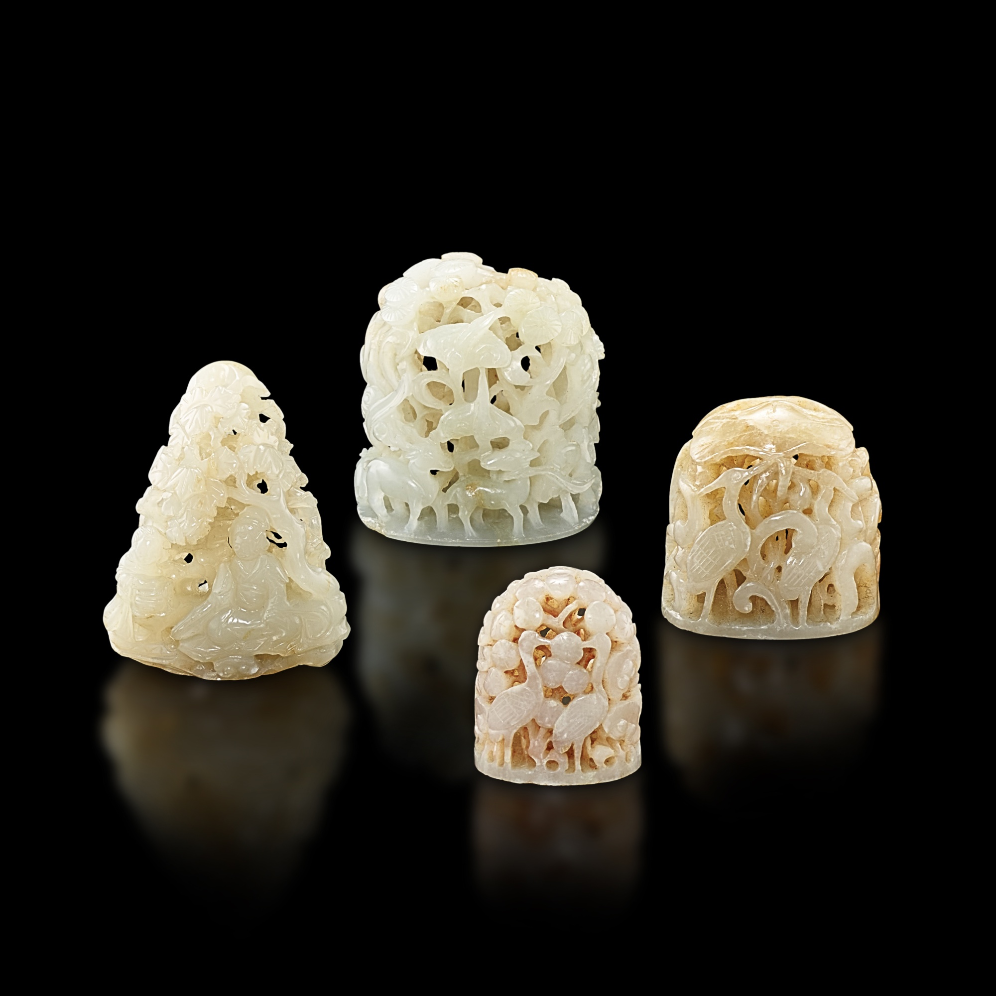 Four reticulated white and russet jade hat finials, Yuan - Ming dyansty ...