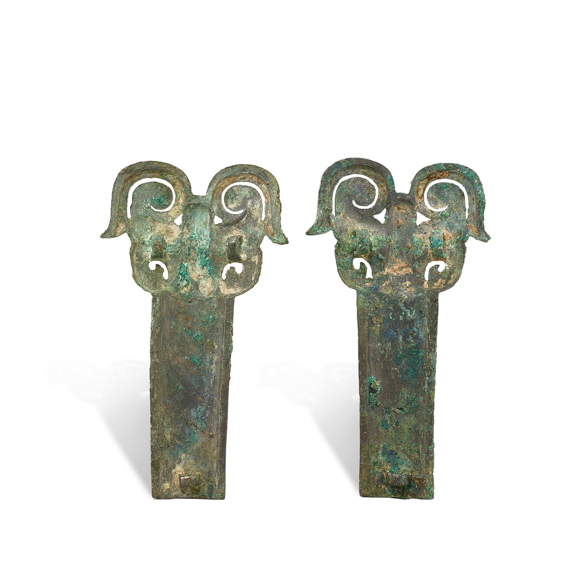 A pair of bronze 'mythical beast' horses' harness frontlets, Western ...