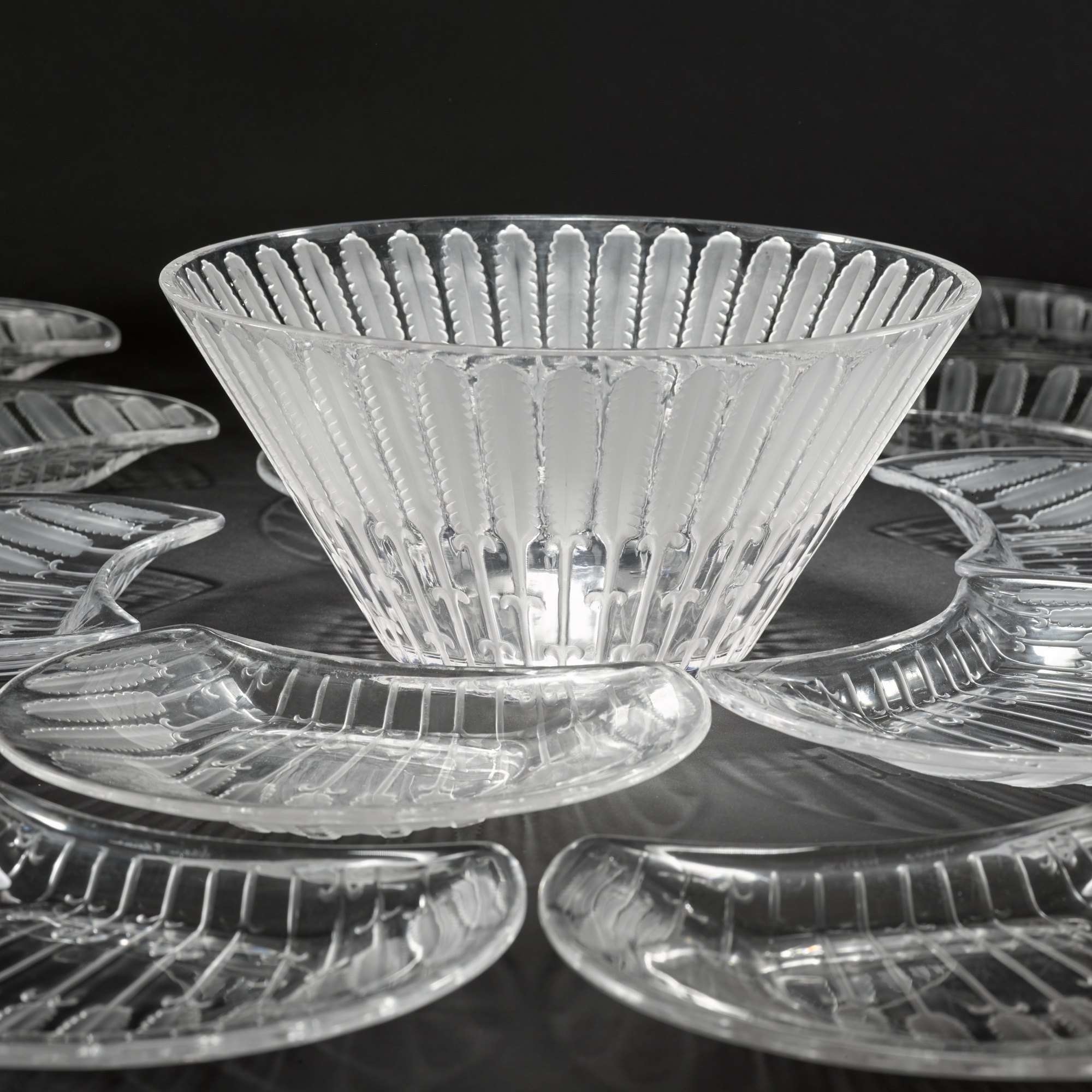 A set of twenty-one Lalique 'Jaffa' glass serving dishes and a bowl ...