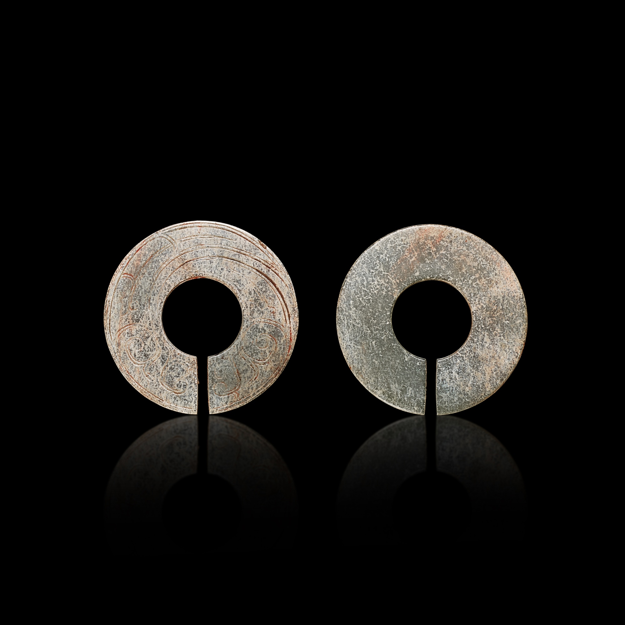 Two pale celadon jade slit rings, jue, Eastern Zhou dynasty 東周 青白玉玦兩件 ...