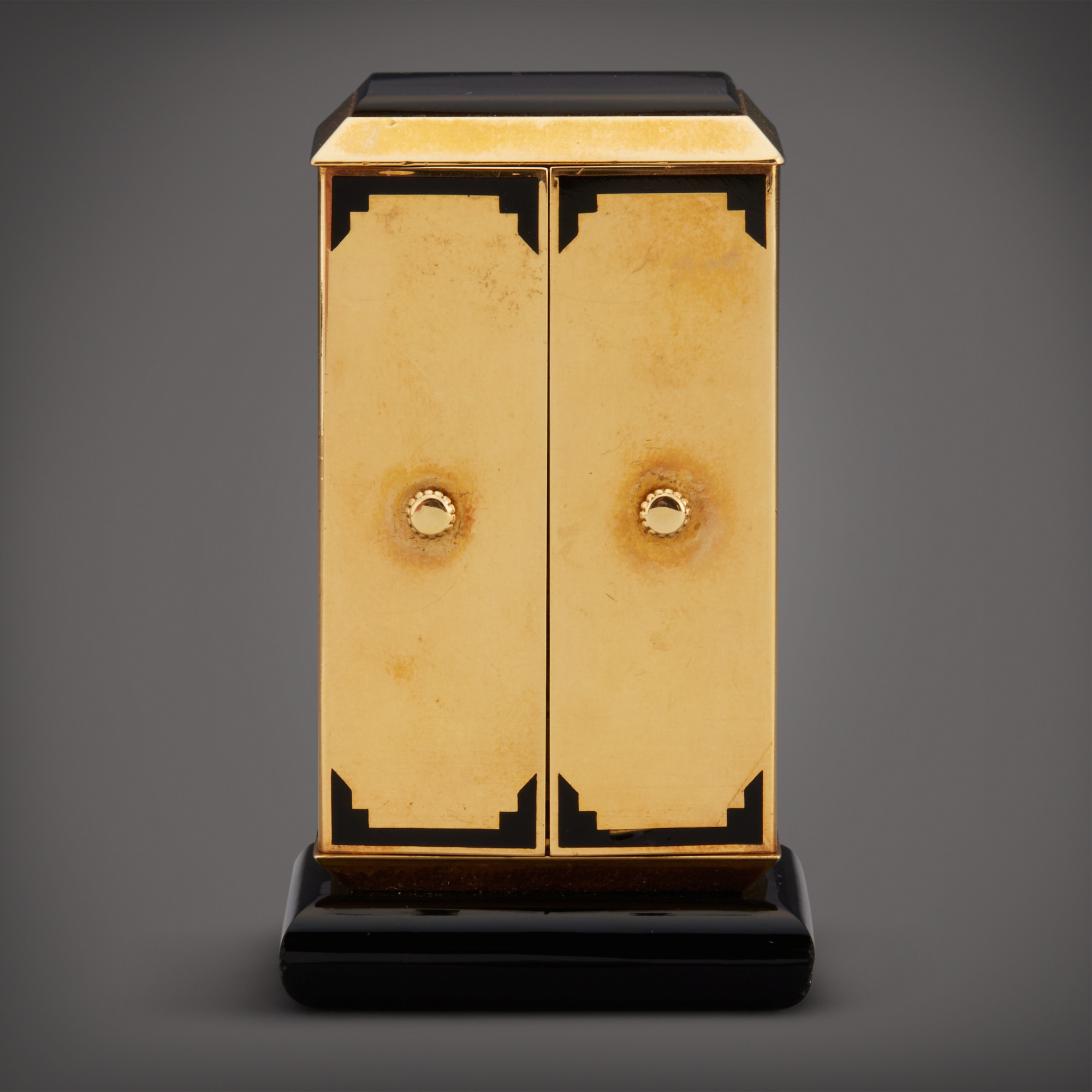A yellow gold, enamel, onyx, and diamond-set miniature triptych desk ...