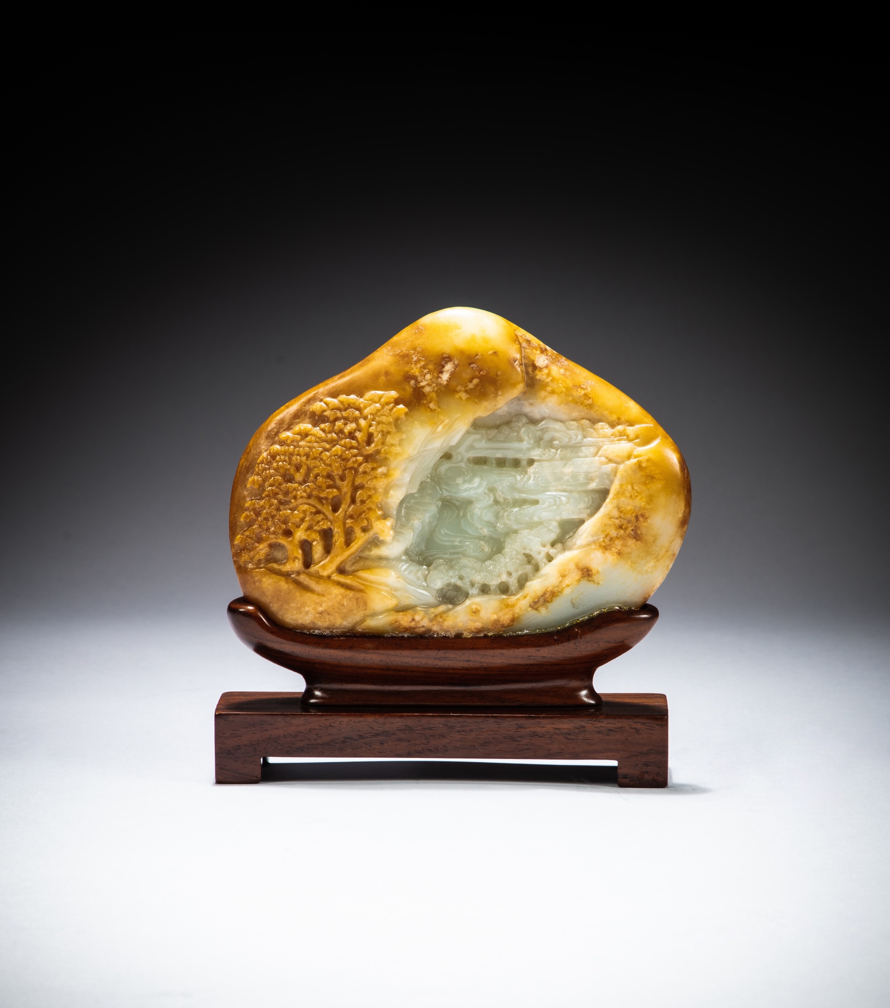 A pale celadon and russet jade mountain boulder, 19th - 20th century ...