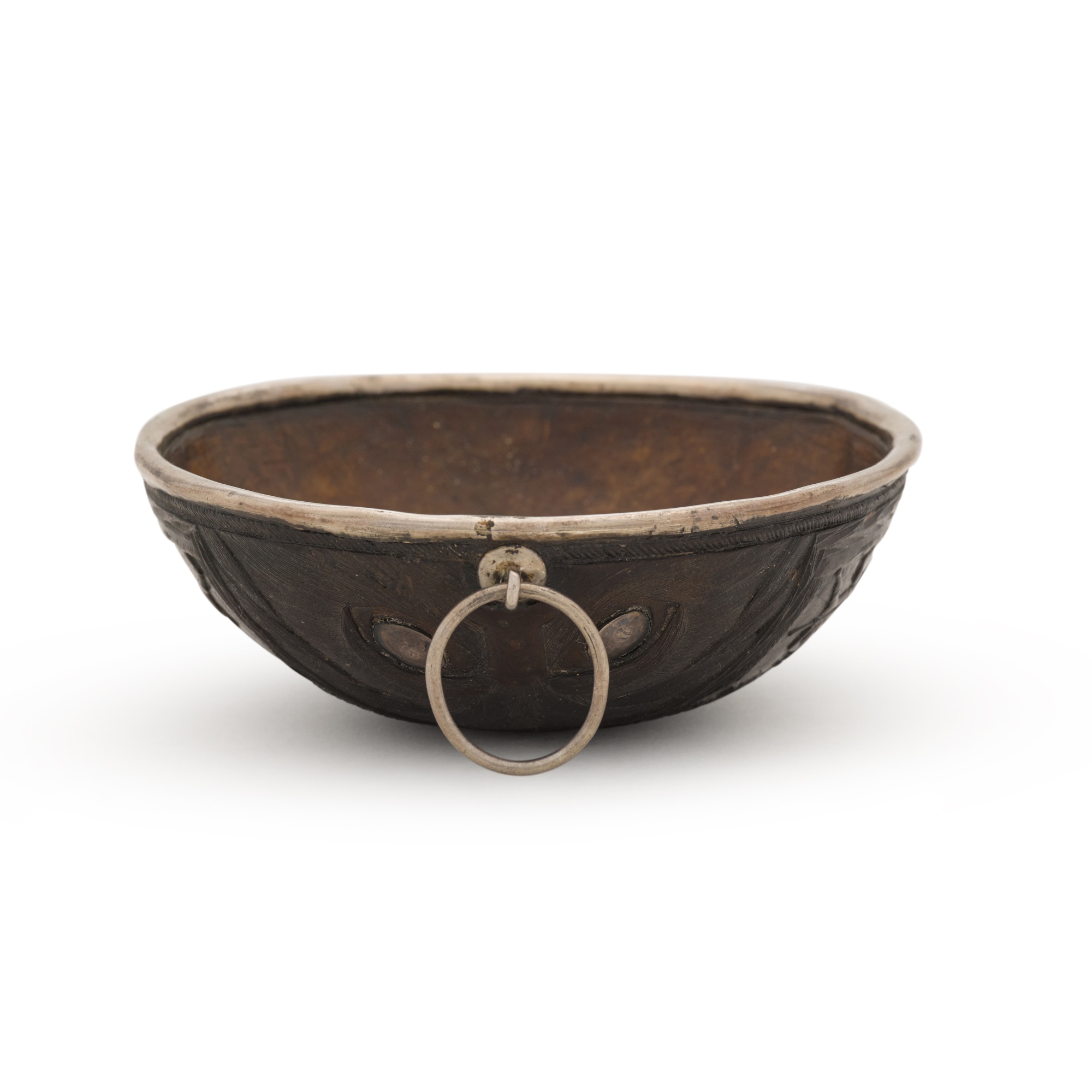 A French colonial silver mounted carved coconut 'bugbear' taste vin ...