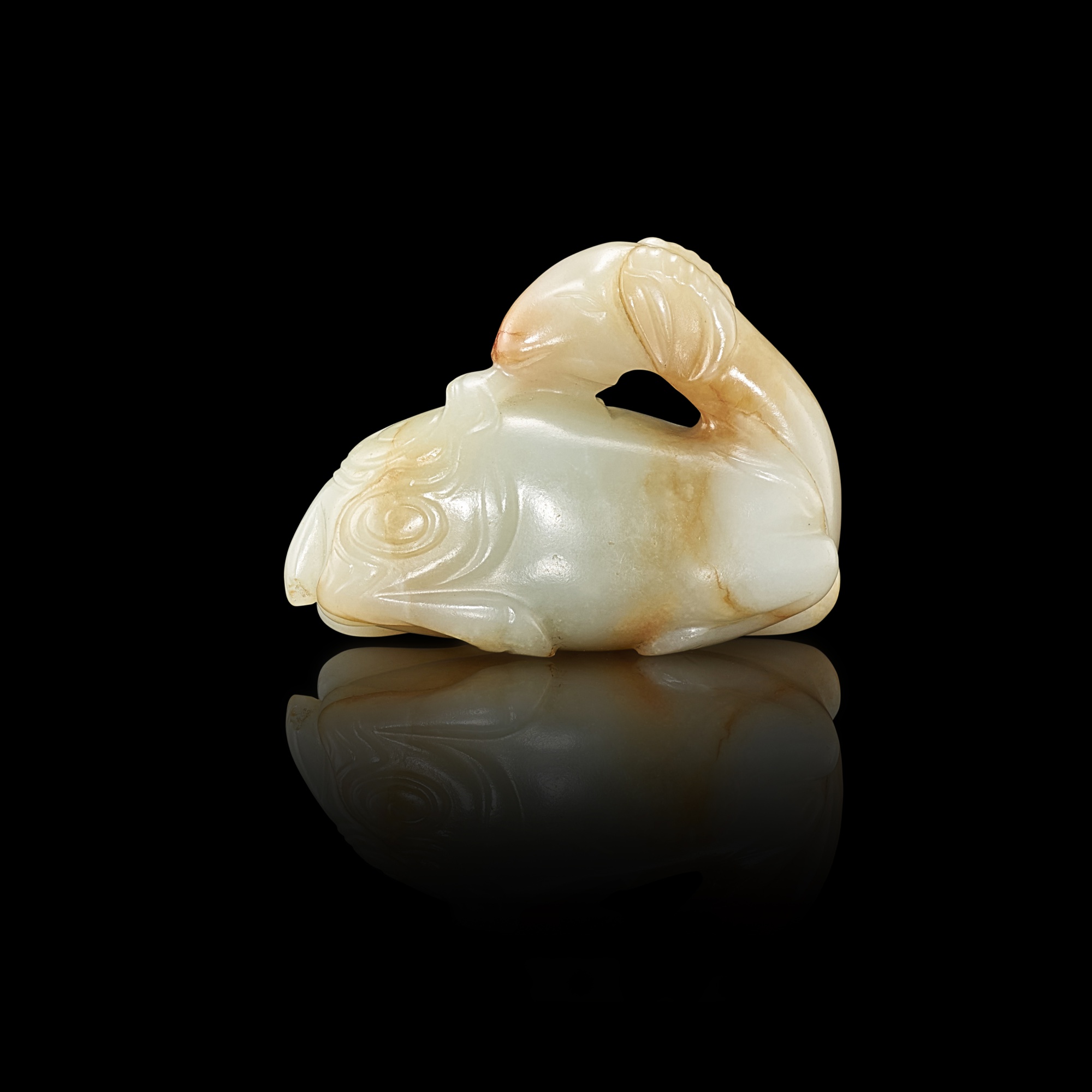 A white and russet jade 'ram and lingzhi' group, Ming dynasty or ...