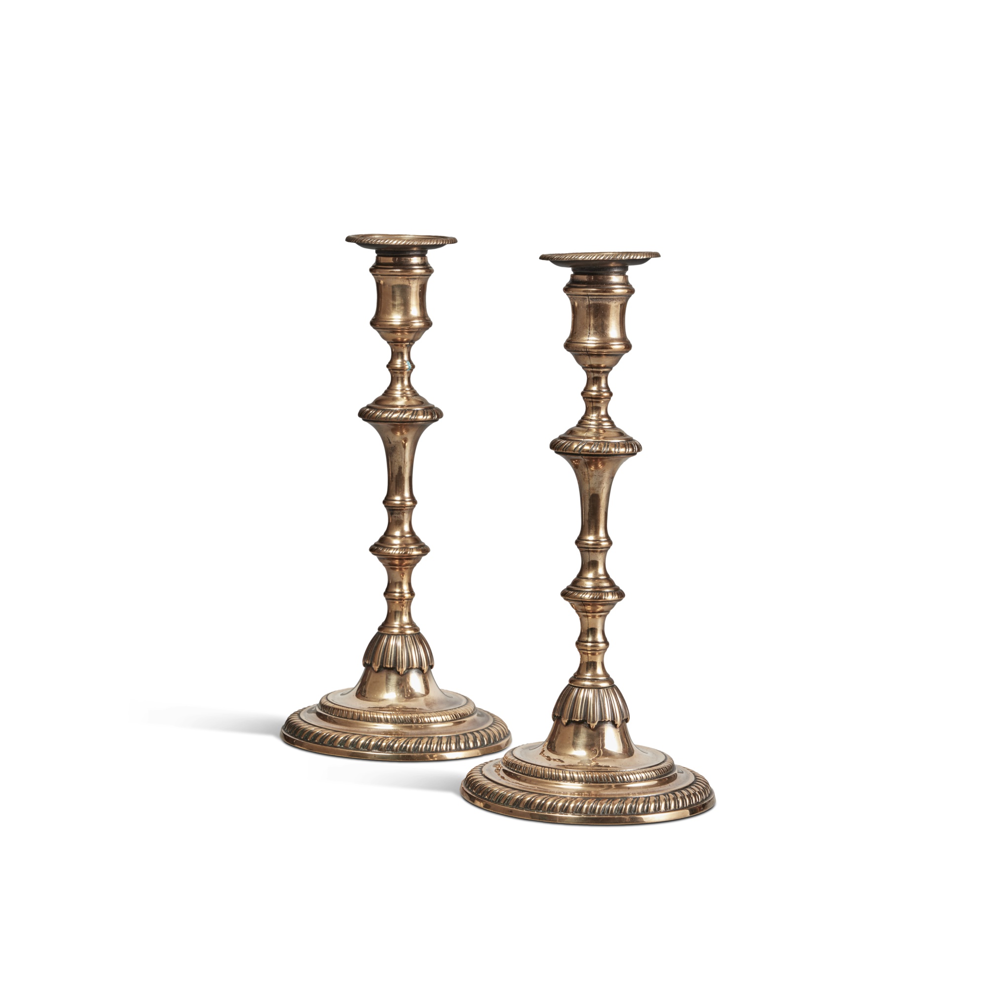 A Pair of English Cast-Brass Gadrooned-Base Candlesticks, circa 1760 ...